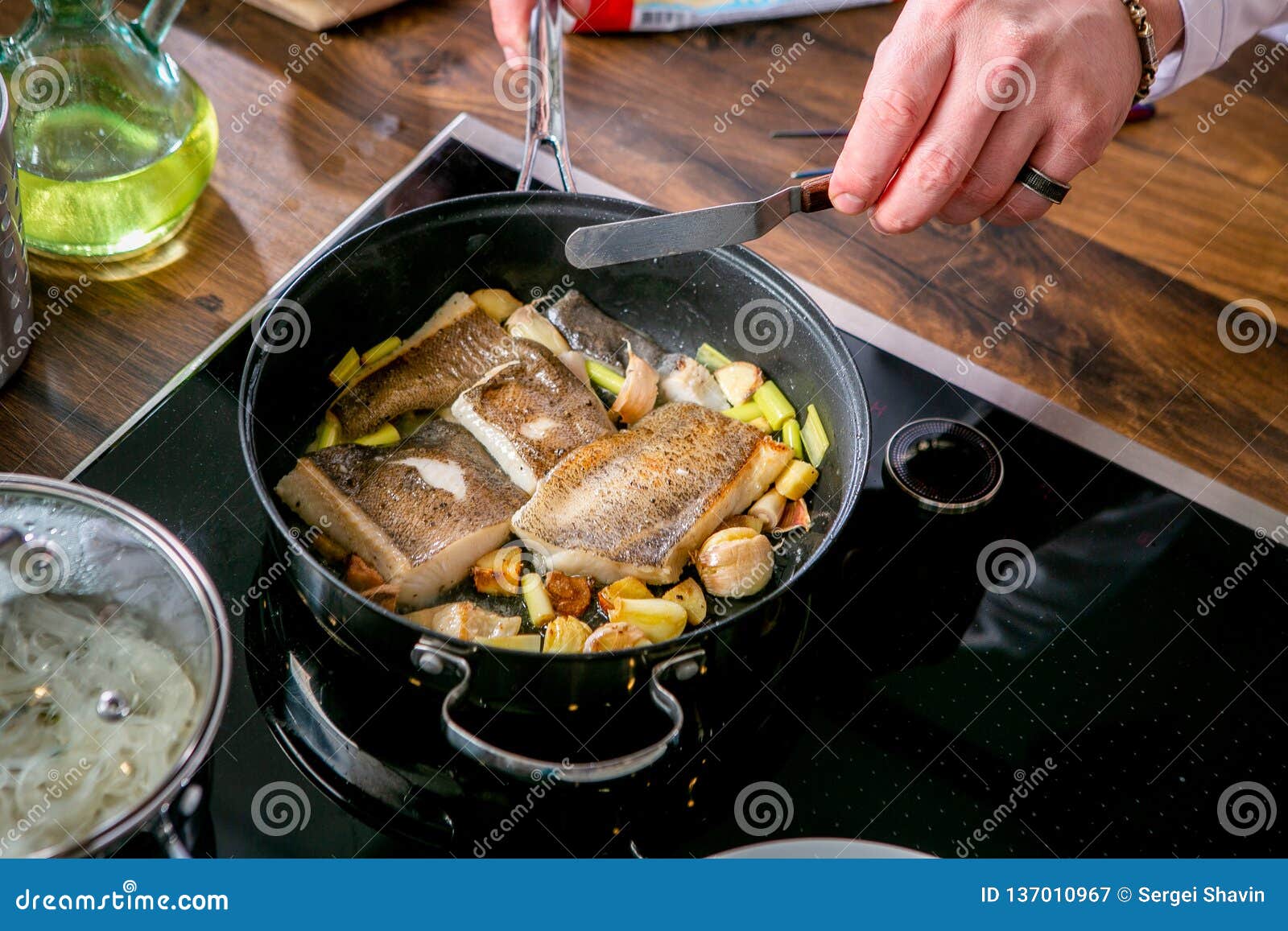 Chef Roasting Pieces Of Halibut In A Pan. Master Class In The Kitchen ...