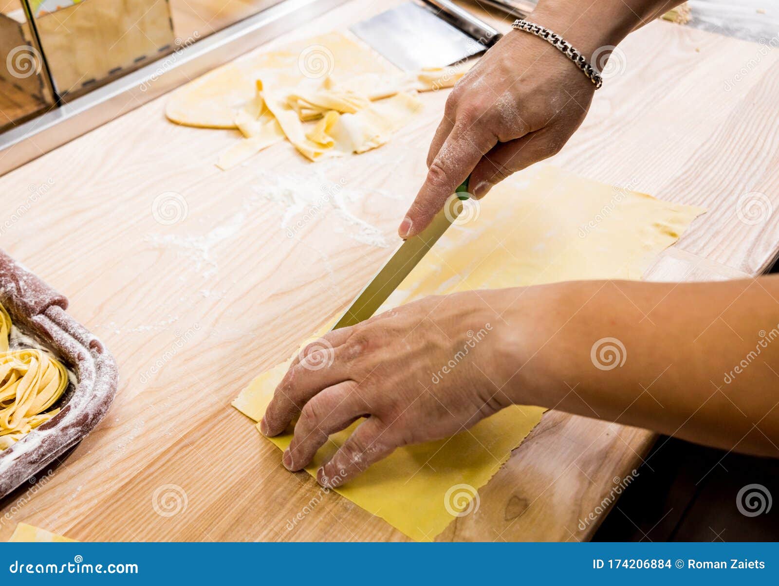 Chef Rolling Dough with a Pasta Machine. Pasta Maker Machine Stock ...