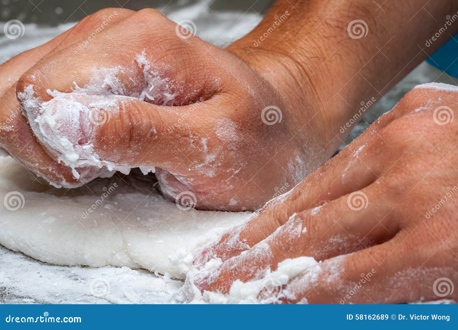 Chef s hand kneading dough stock image. Image of food - 58162689