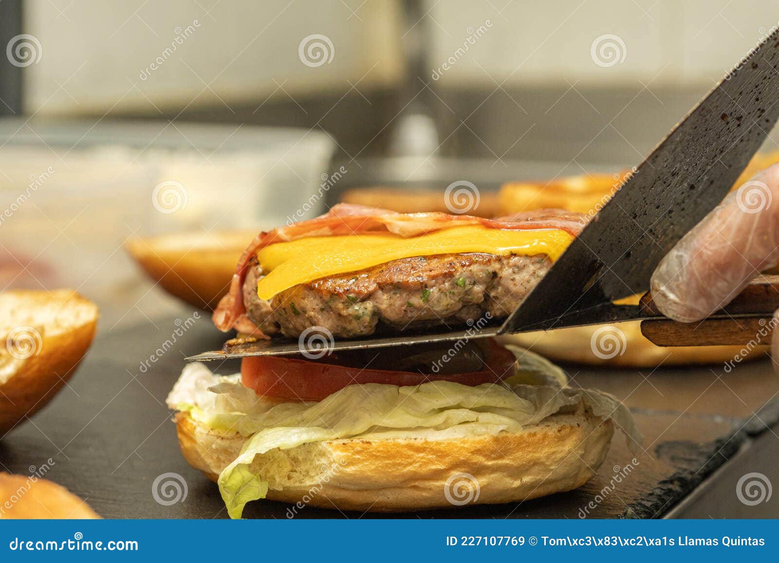 Chef S Hands Assembling Burgers with Cheddar Cheese and Bacon Over ...