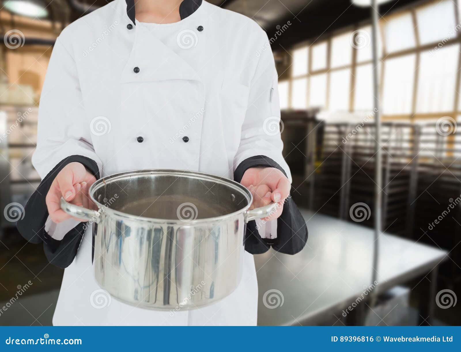 Chef with Saucepan Against Blurry Kitchen Stock Photo - Image of ...