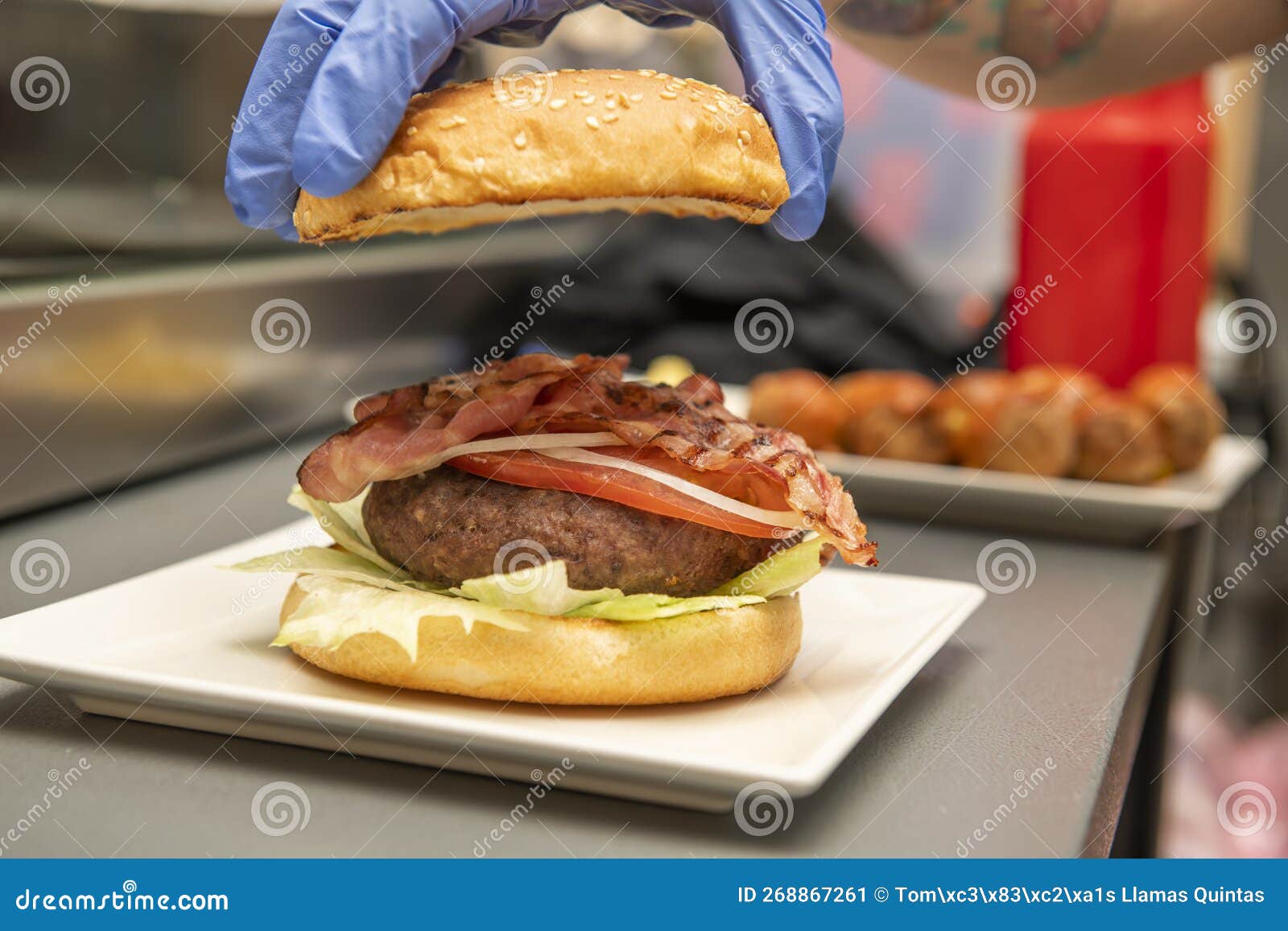 A Chef Showing Off a Freshly Cooked Hamburger with Bacon Stock Image ...