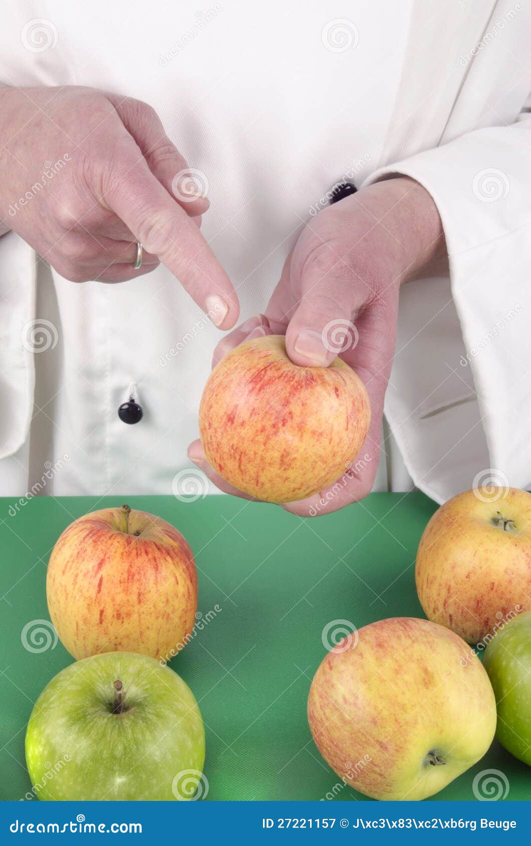 Chef Shows with Her Index Finger on an Apple Stock Image - Image of ...