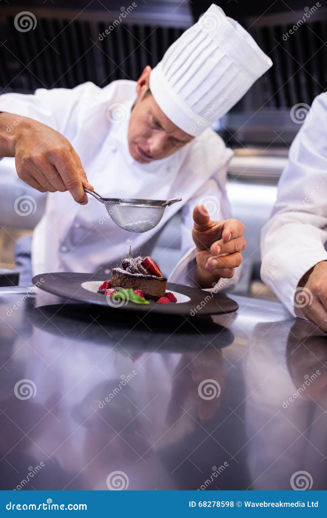 Chef Sieving Icing Sugar Over a Dessert Stock Photo - Image of ...