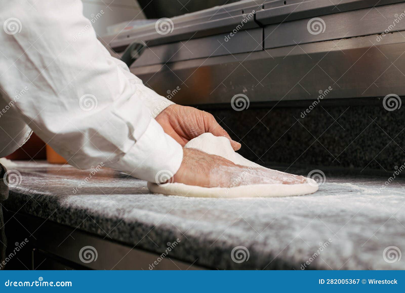 Chef is Skillfully Making Pizza Dough on a Marble Kitchen Countertop ...