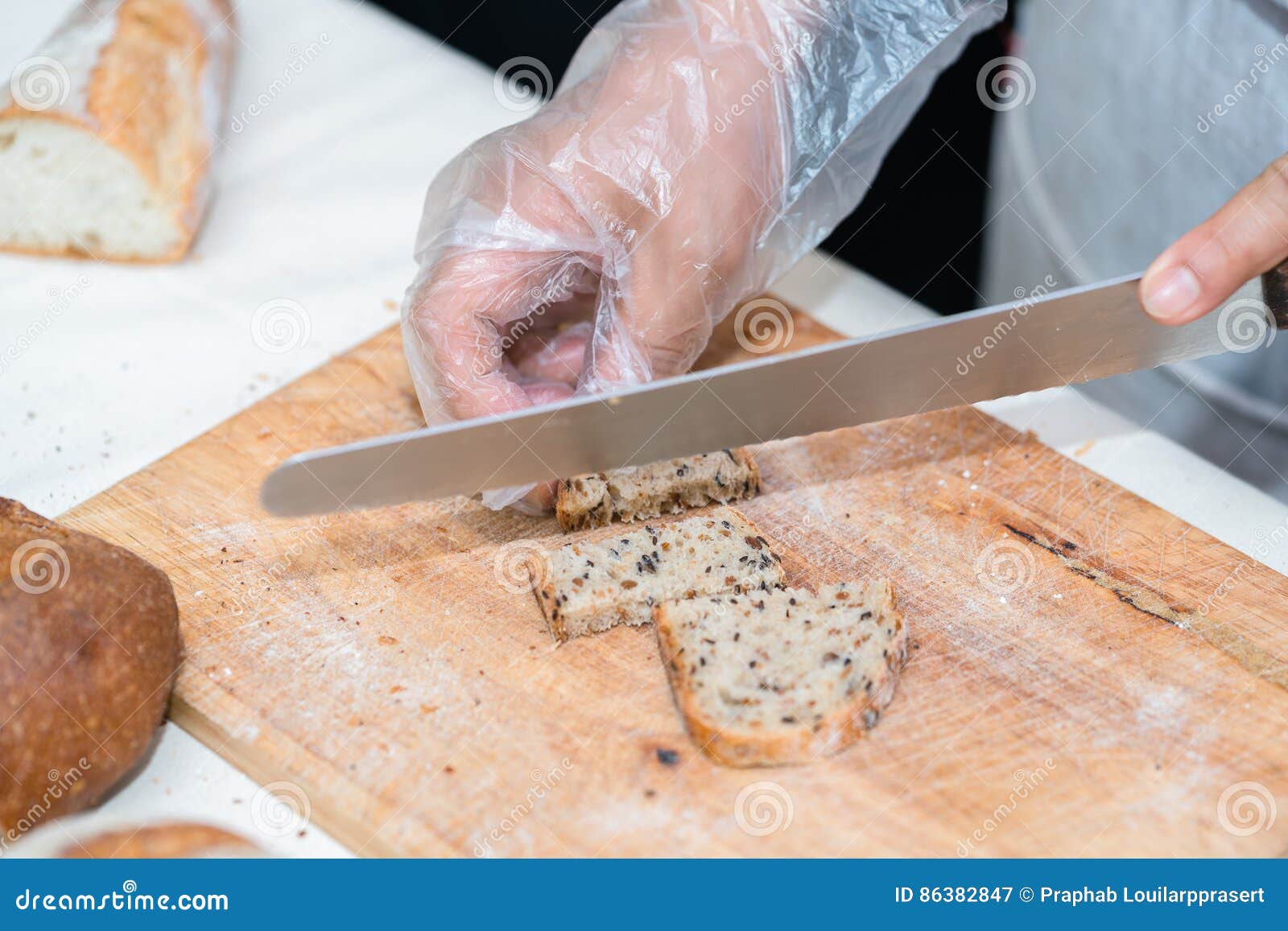 Chef Slicing Bread in Th Kitchen Stock Image - Image of caucasian ...