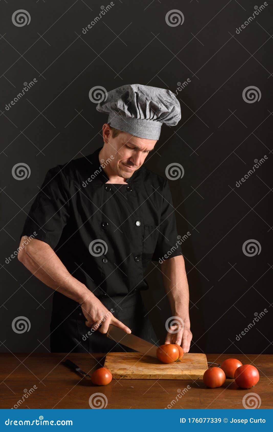 Chef slicing tomato stock image. Image of adult, smile - 176077339