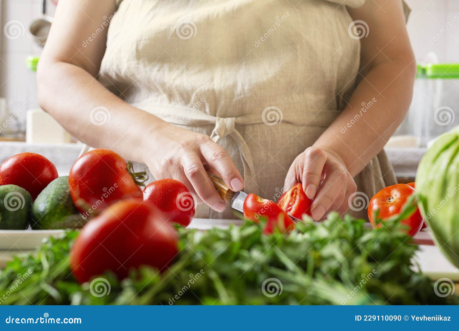 Chef Slicing Tomato Using Knife on the Table in Restaurant. Process of ...