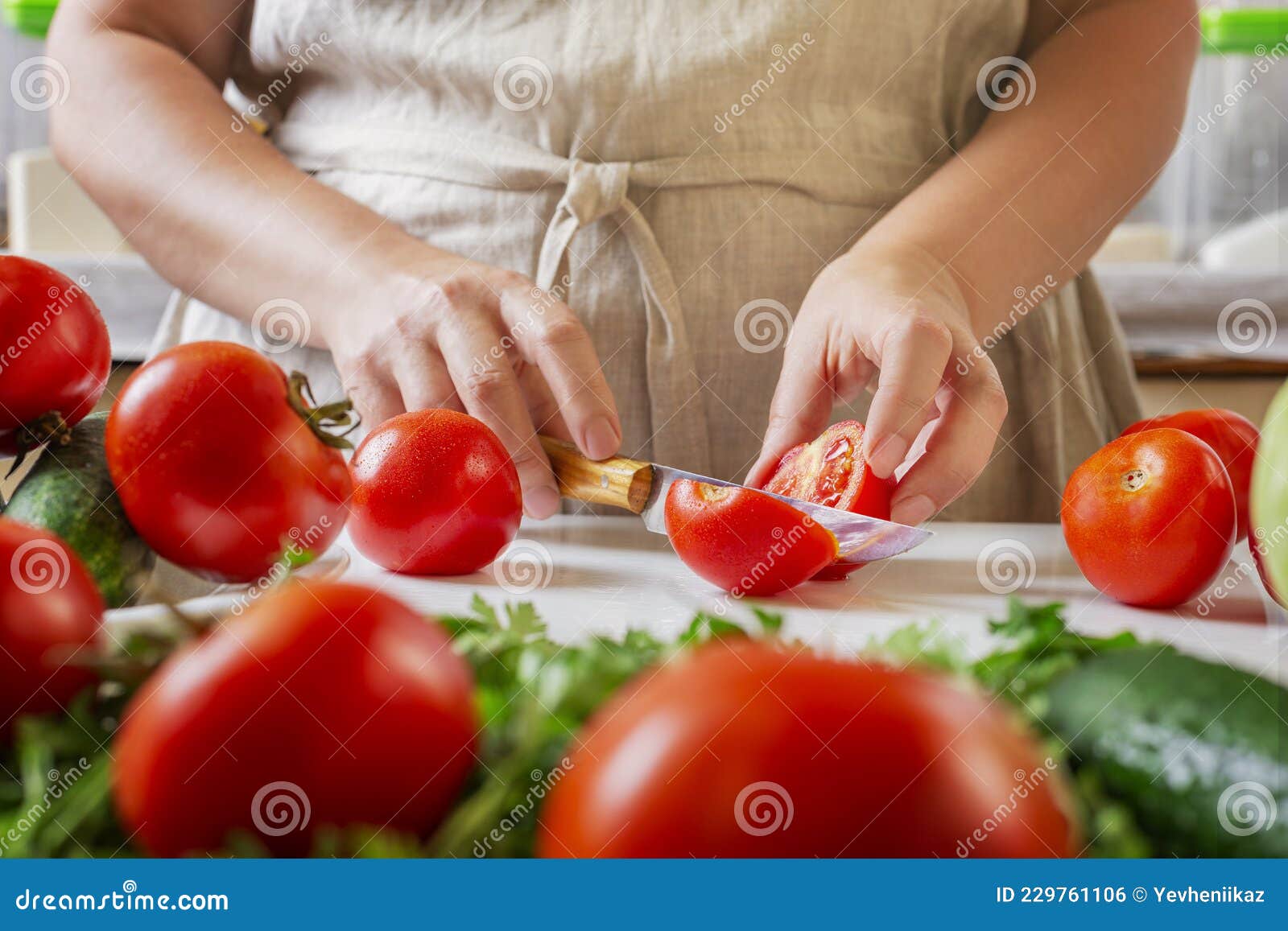 Chef Slicing Tomato Using Knife on the Table in Restaurant. Process of ...