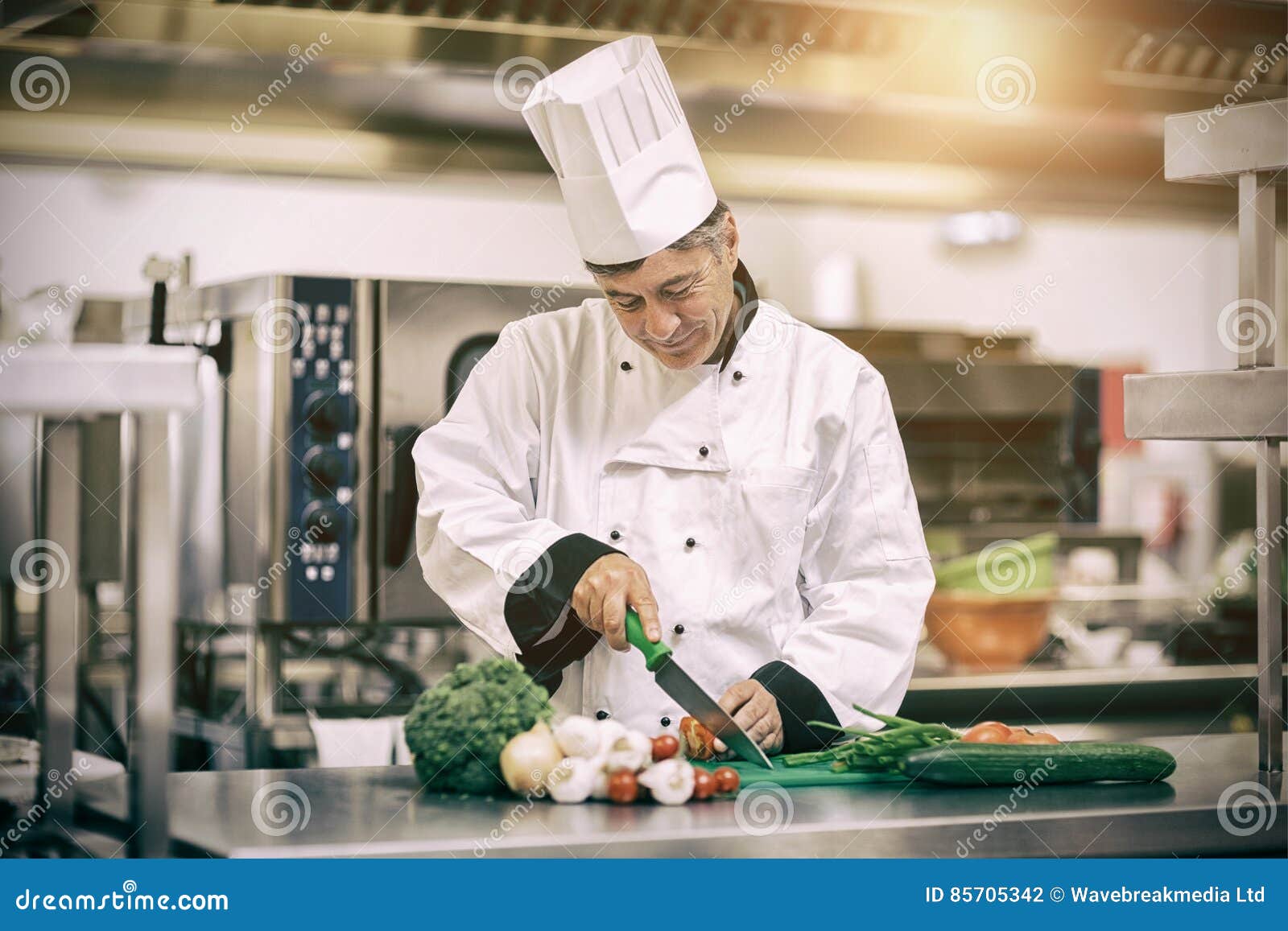 Chef Slicing Tomatoes in Professional Kitchen Stock Photo - Image of ...