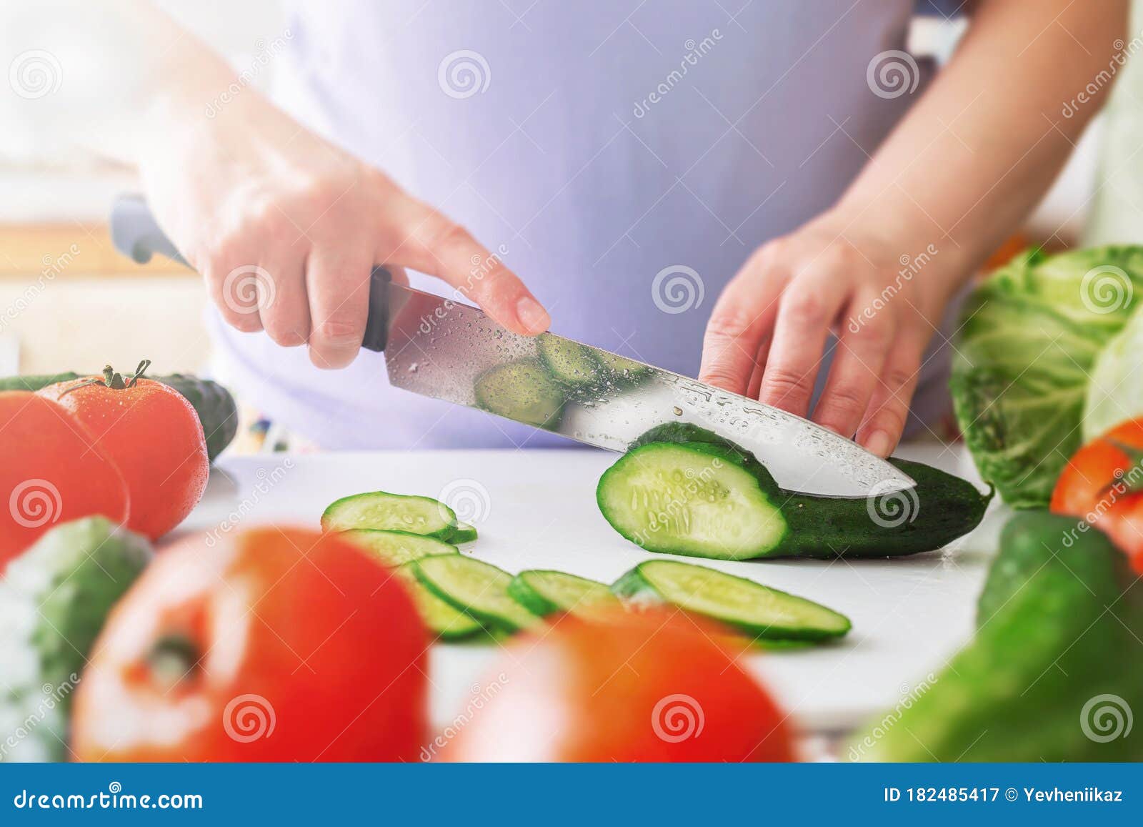 Chef Slicing Vegetables and Cucumber on the Table in Restaurant ...
