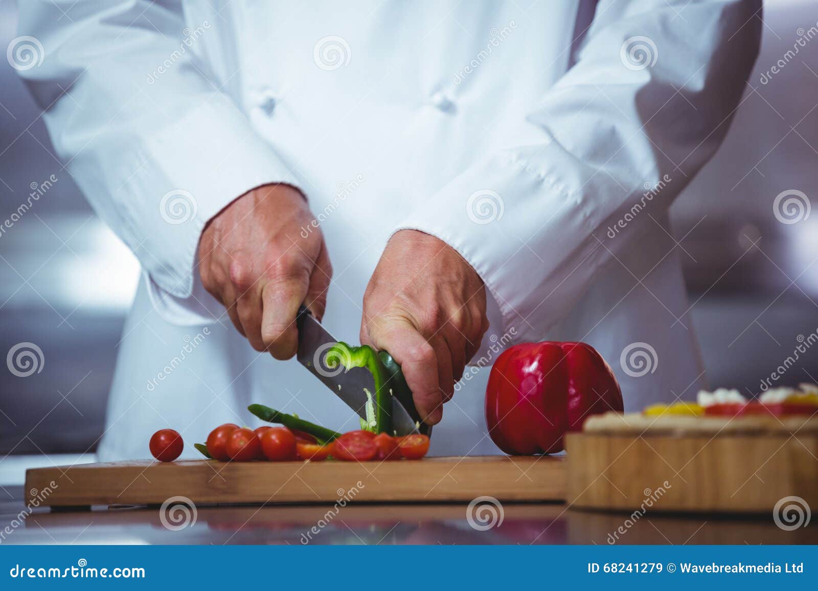 Chef slicing vegetables stock image. Image of catering - 68241279