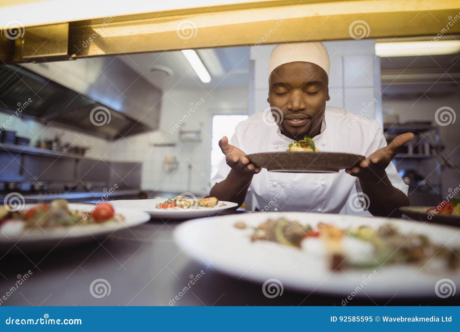 Chef Smelling Food in Commercial Kitchen Stock Image - Image of happy ...