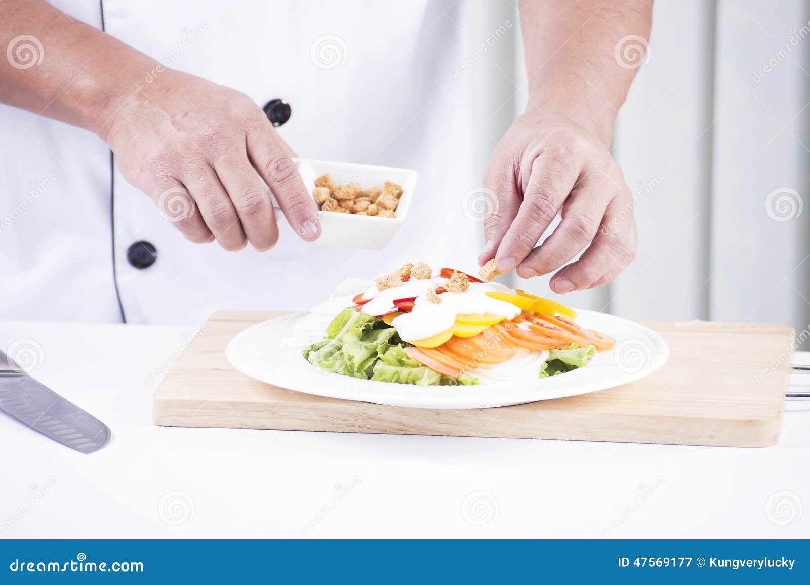 Chef Sprinkle Biscuits on Salad Stock Image - Image of salad, cuisine ...