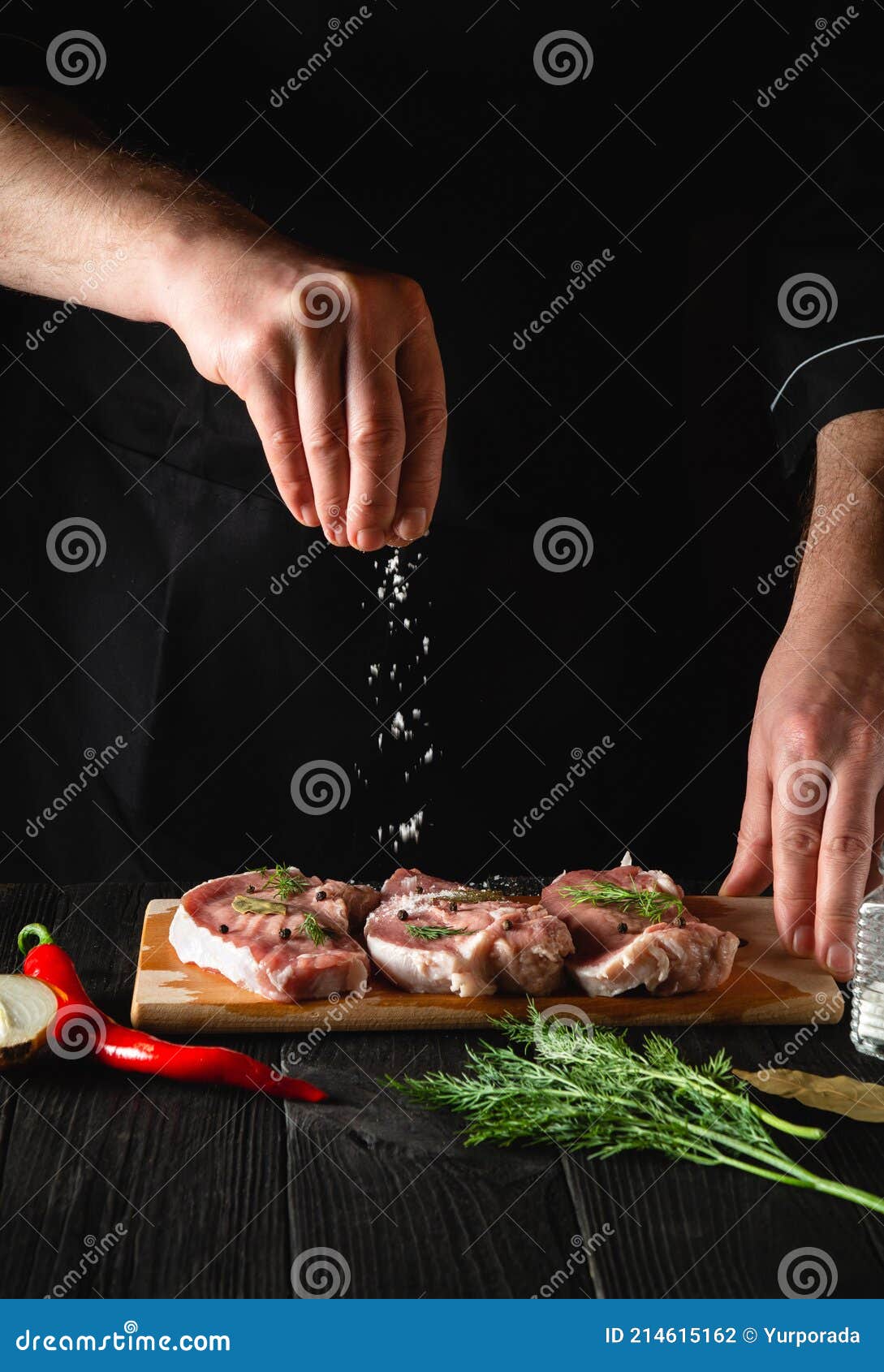 The Chef Sprinkles the Meat with Salt. Preparing Meat before Baking ...