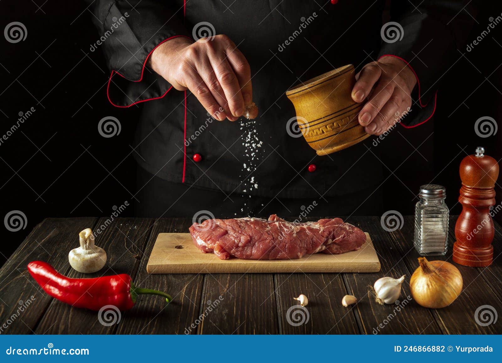 The Chef Sprinkles Raw Meat with Salt. Preparing Beef Meat before ...