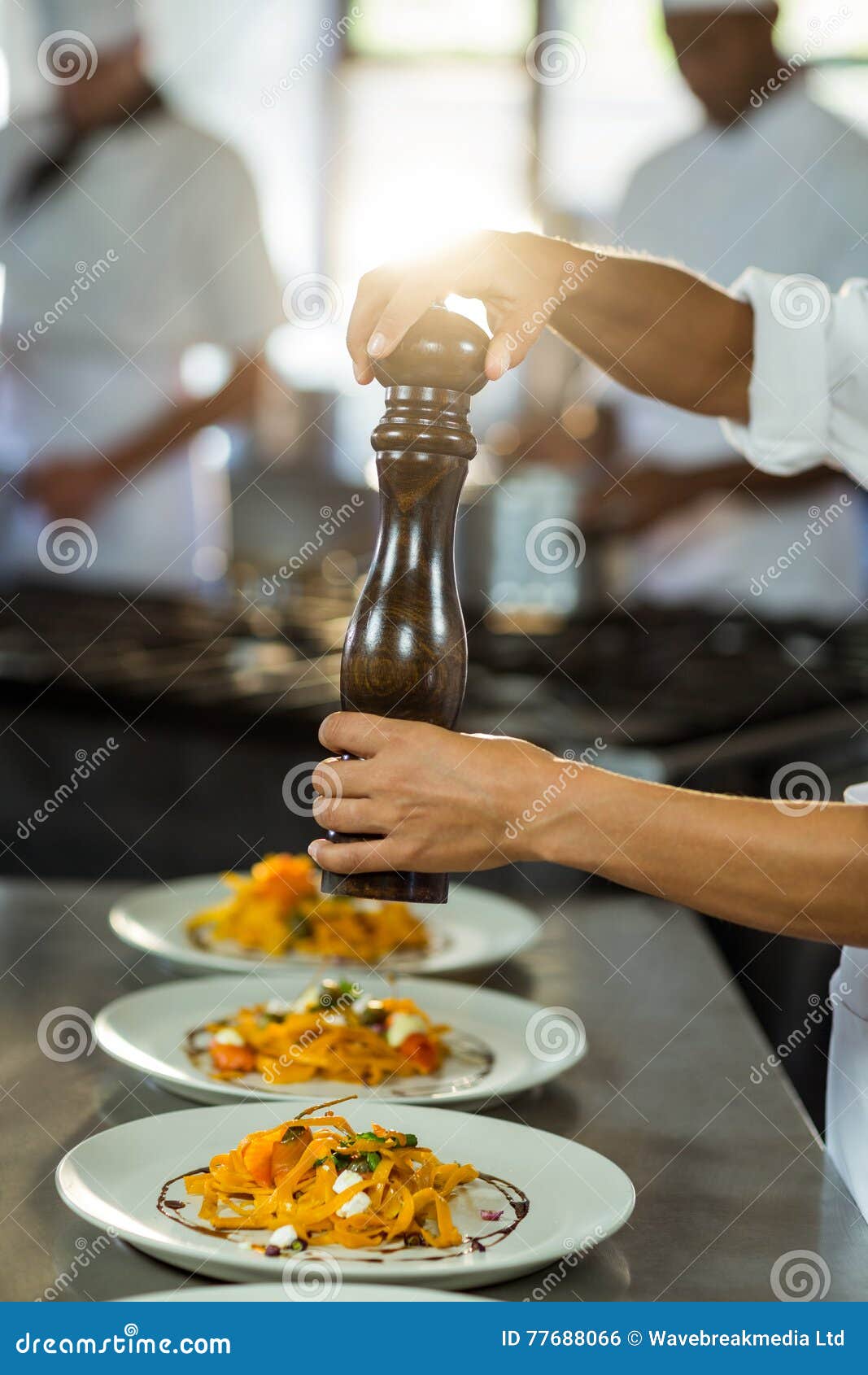 Chef Sprinkling Pepper on a Meal Stock Photo - Image of hotel, food ...