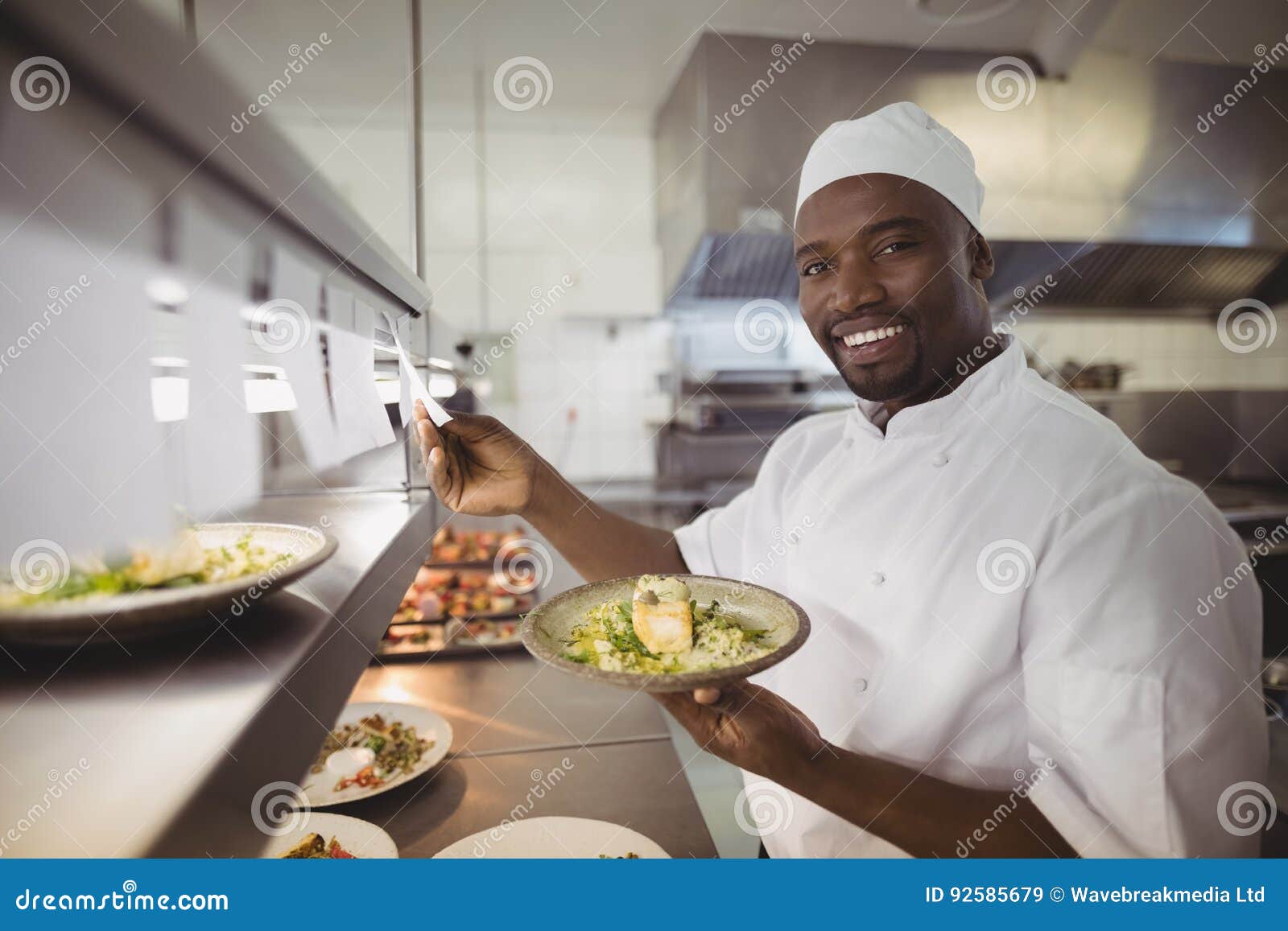 Chef Standing at an Order Station in the Commercial Kitchen Stock Image ...