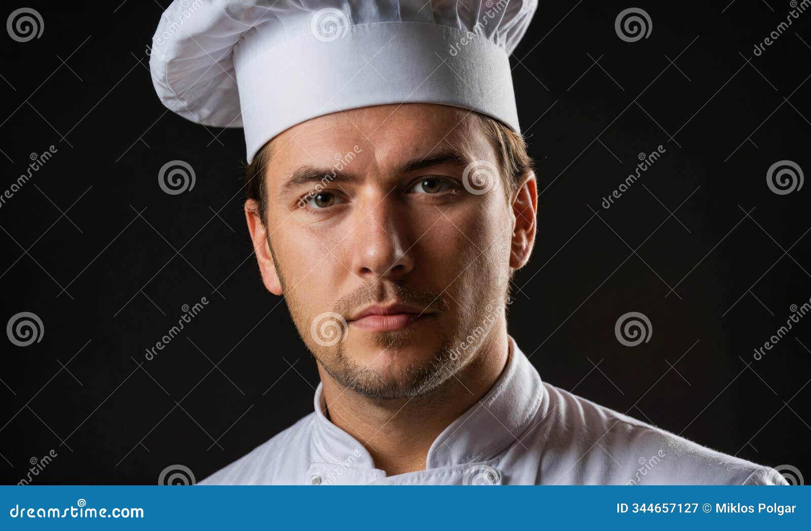 A Chef Stares Intensely at the Camera while Wearing a White Chef S Hat ...