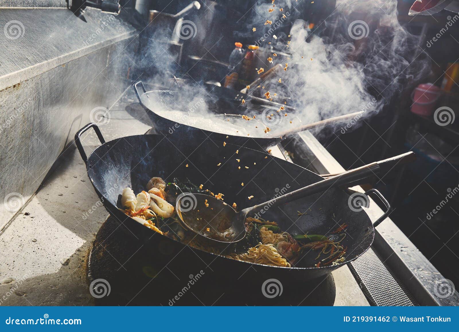Chef stir fry cooking stock photo. Image of stainless - 219391462