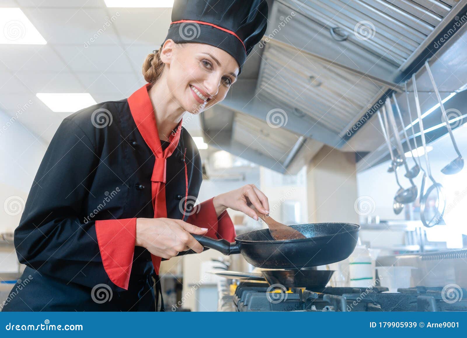 Chef stirring a meal stock image. Image of lunch, apron - 179905939