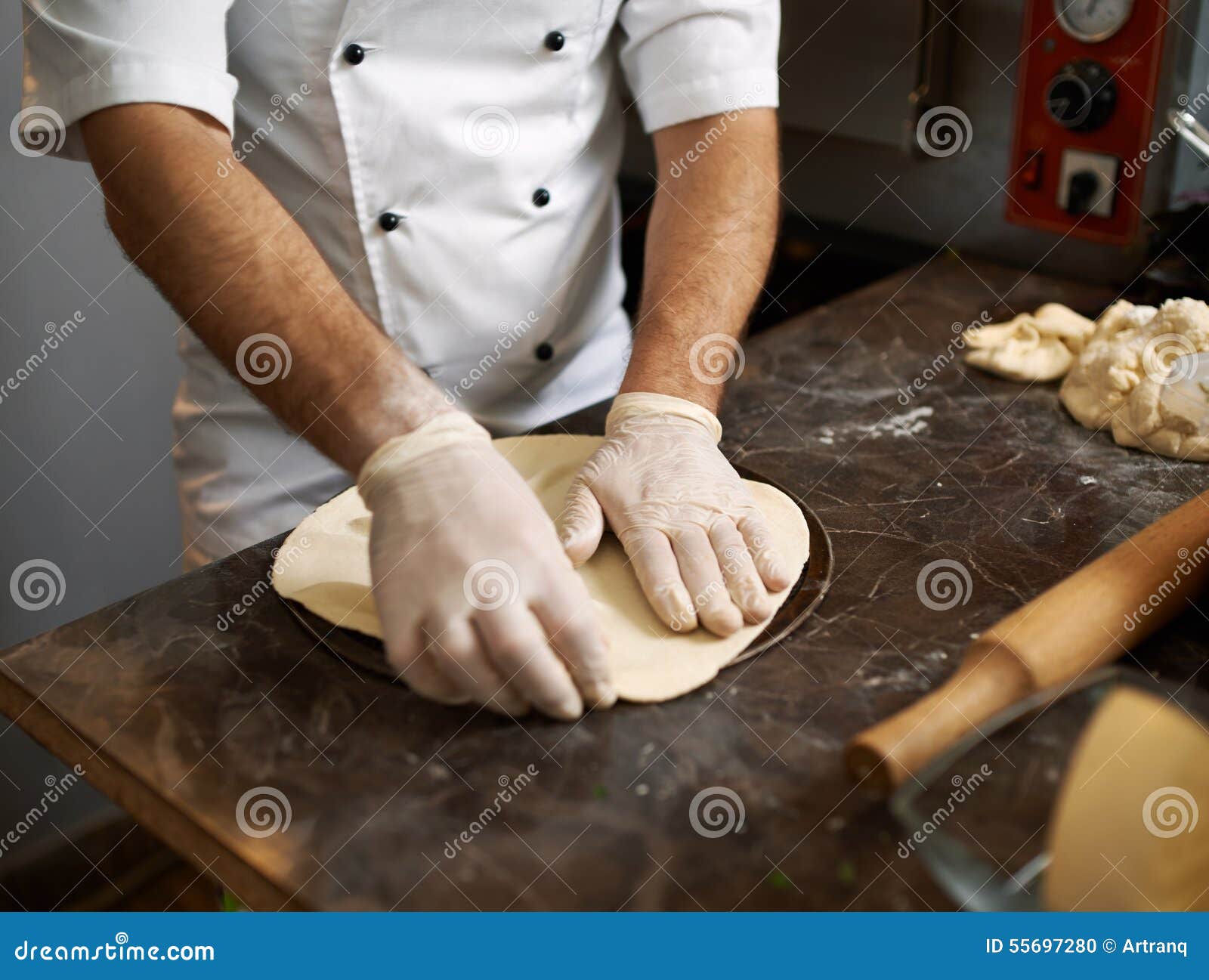 Chef stretches pizza dough stock photo. Image of meal - 55697280