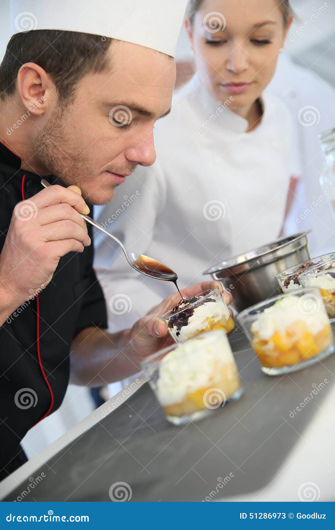 Chef with Student Pouring Chocolate on Dessert Stock Image - Image of ...