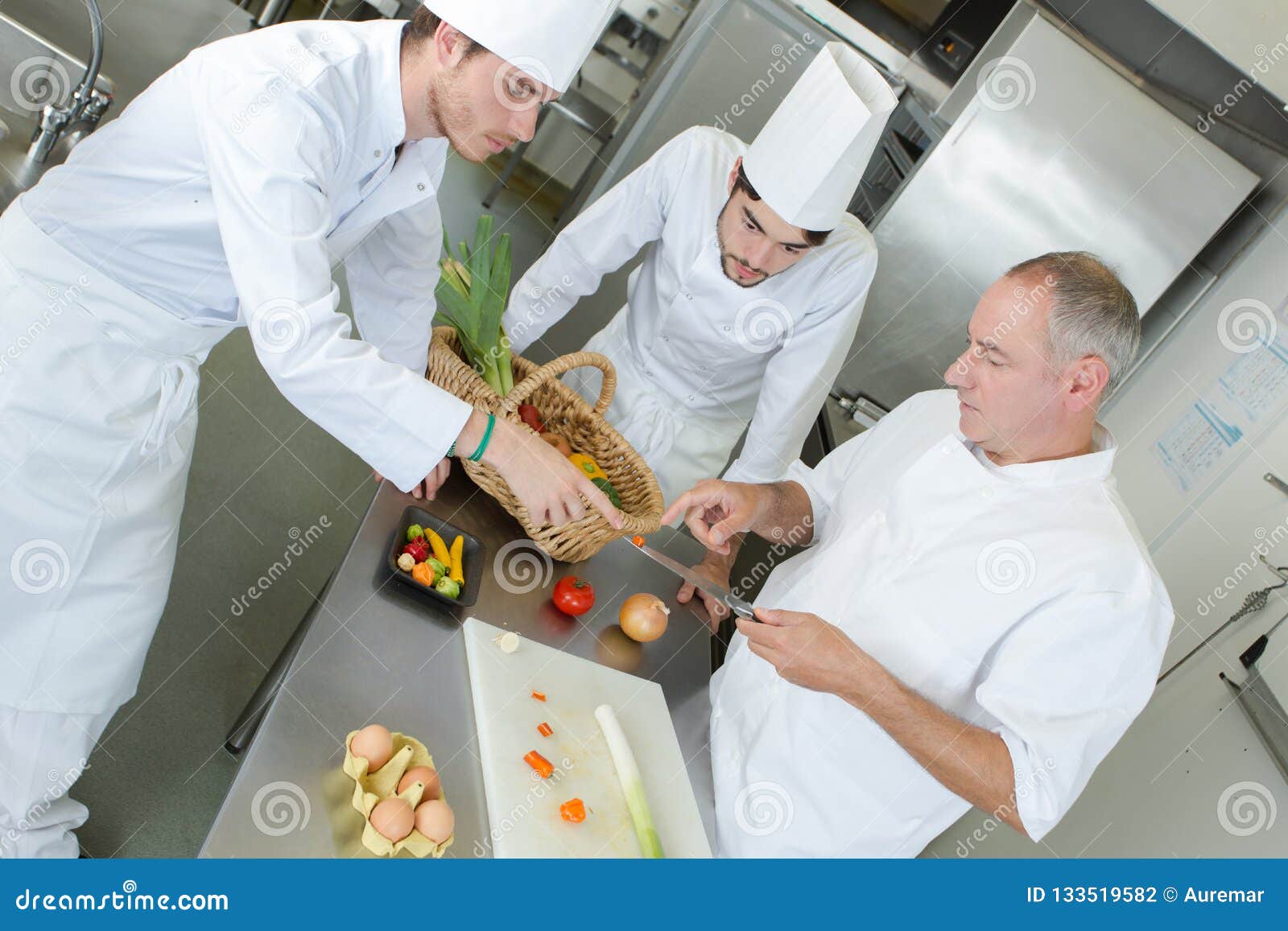 Chef Supervising Trainees Cooking Stock Photo - Image of food ...