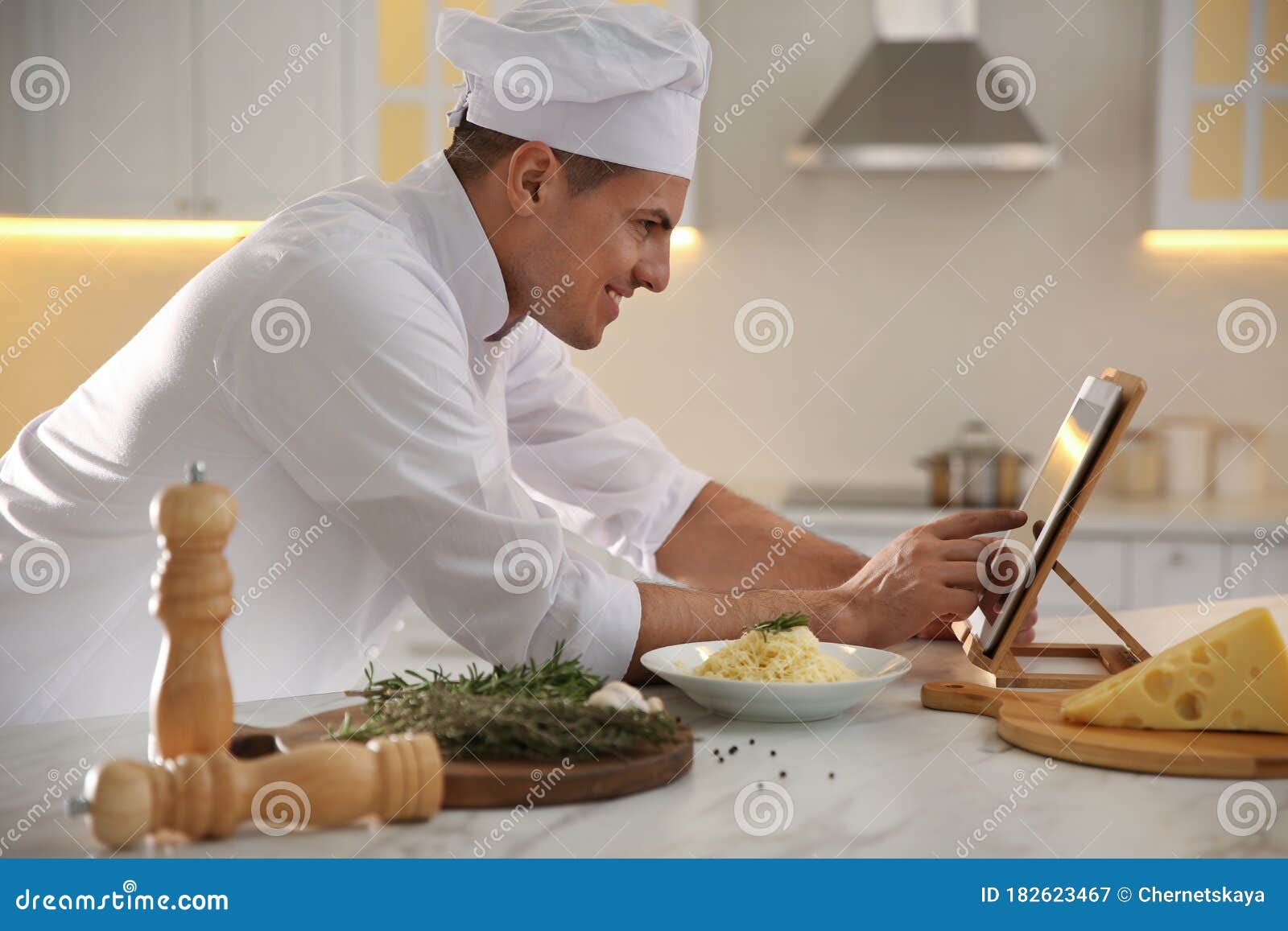 Chef with Tablet Cooking at Table Stock Image - Image of beautiful ...