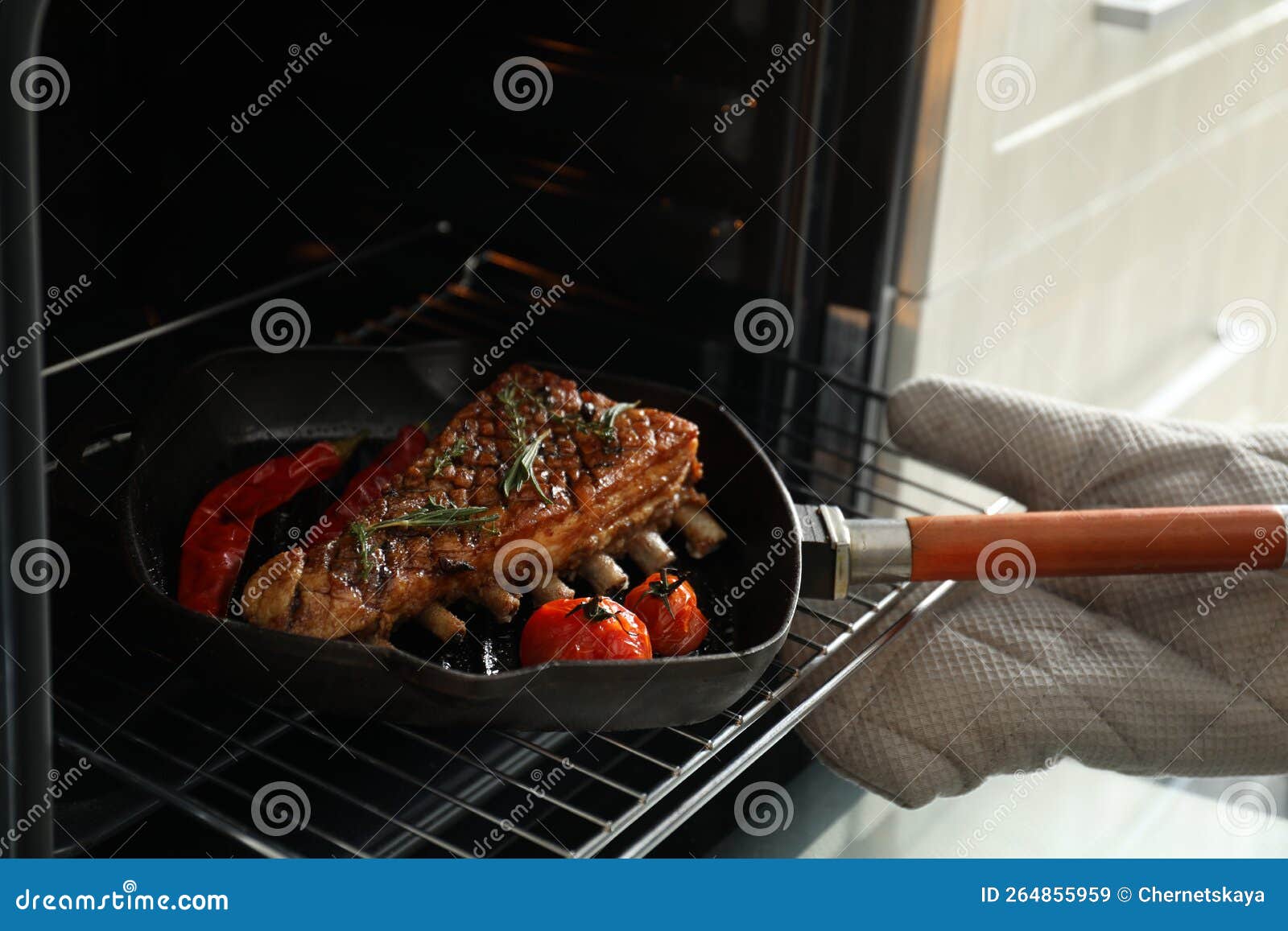Chef Taking Pan with Delicious Roasted Ribs Out of Oven, Closeup Stock ...