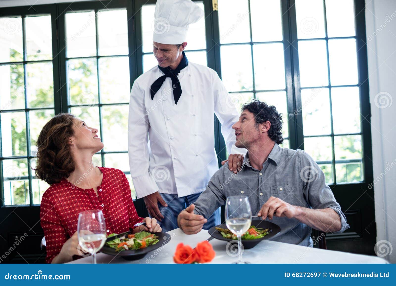 Chef talking to couple stock image. Image of couple, gourmet - 68272697