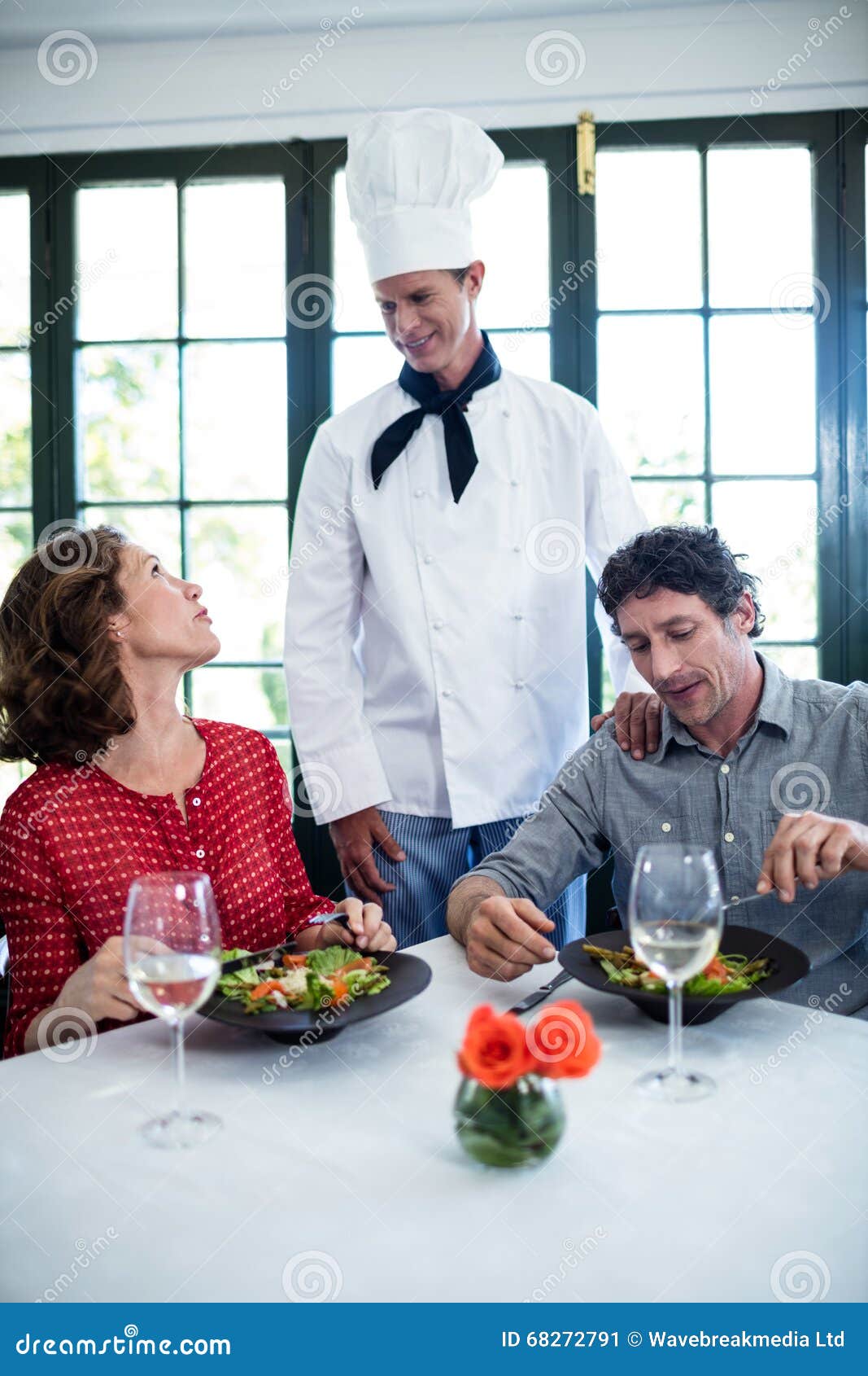 Chef talking to couple stock image. Image of lifestyle - 68272791