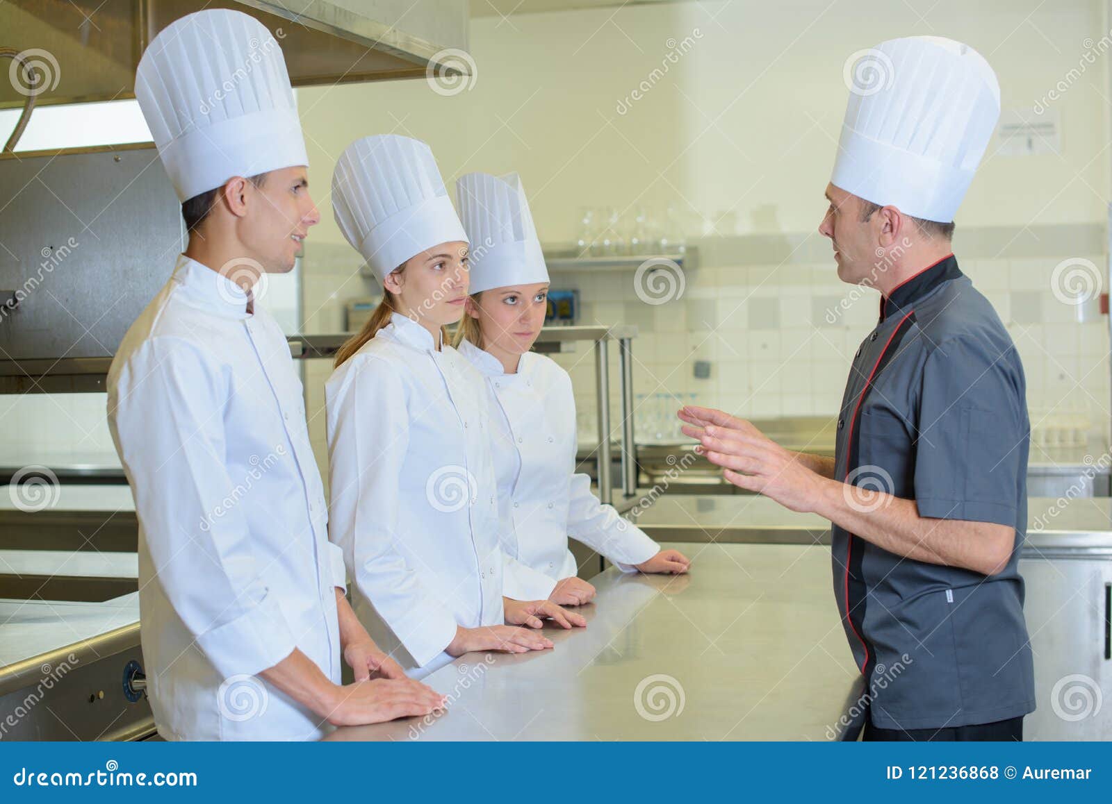 Chef talking to trainees stock photo. Image of work - 121236868