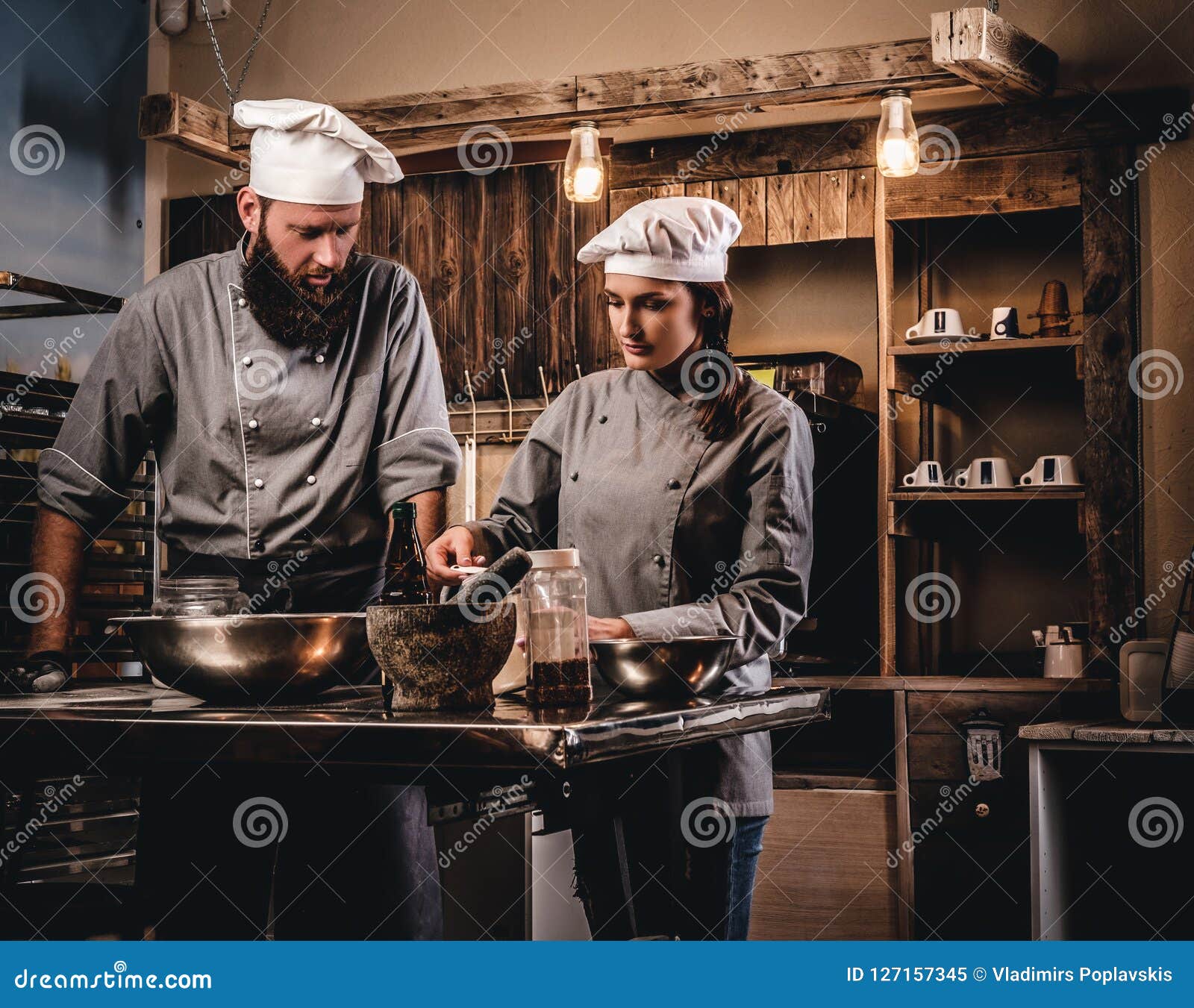 Chef Teaching His Assistant To Bake the Bread in the Bakery. Stock ...