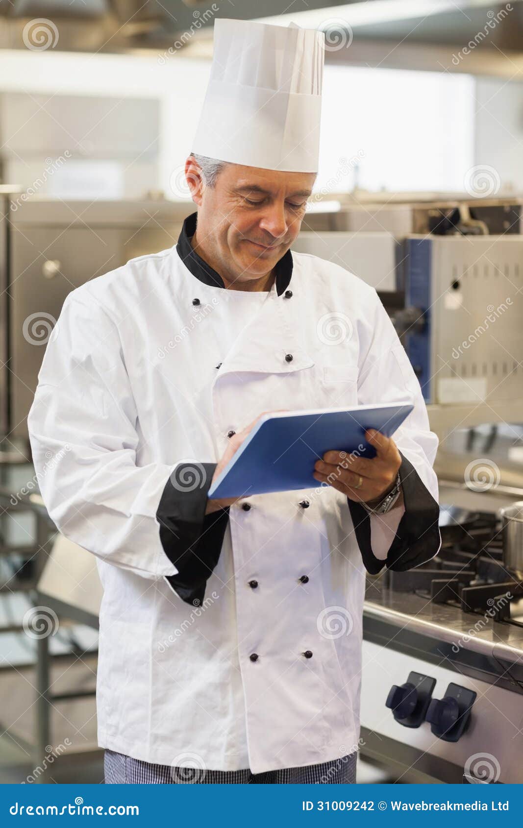 Chef Using His Digital Tablet Stock Photo - Image of chef, male: 31009242