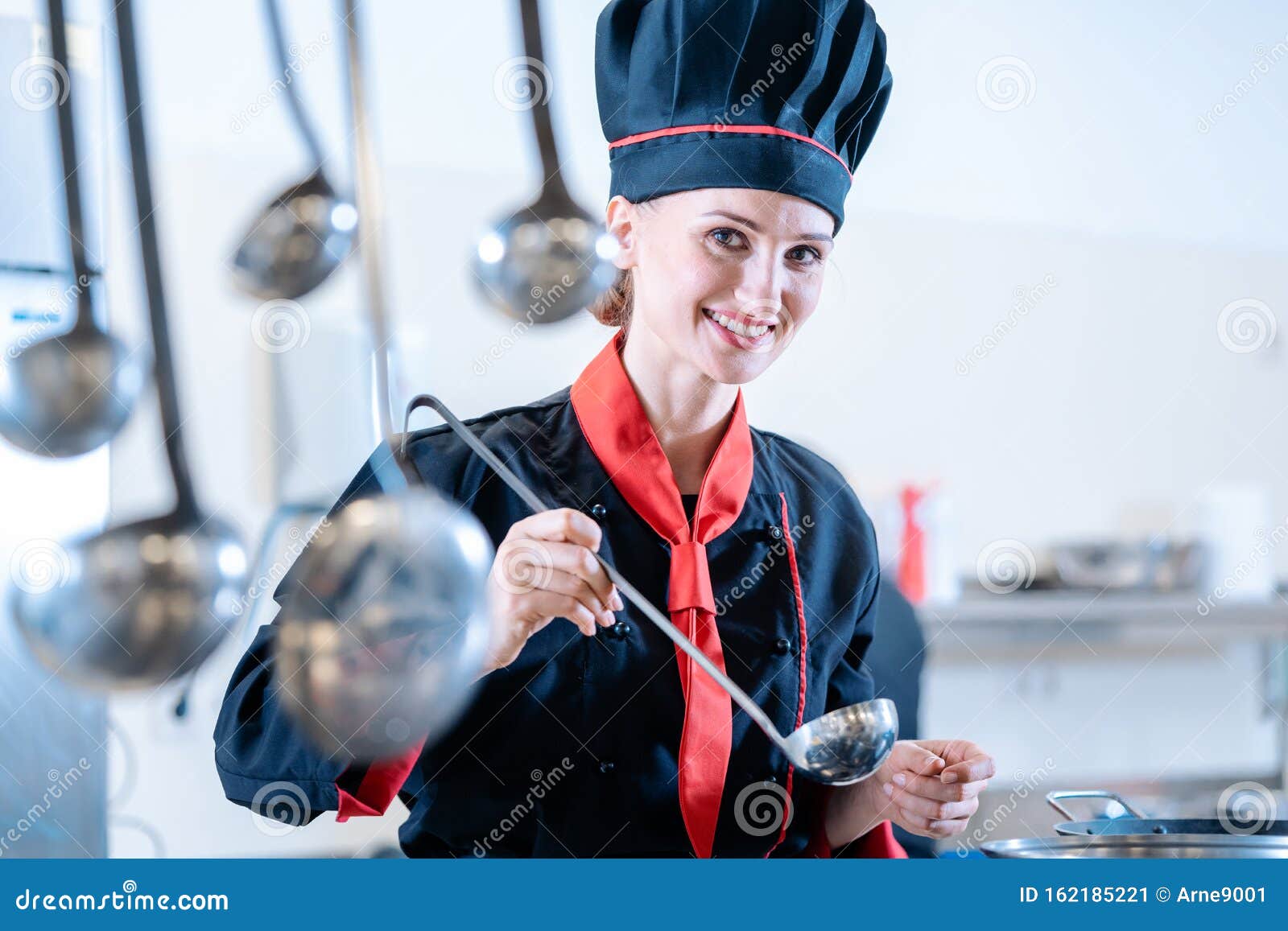 Chef using a metal ladle stock image. Image of ladle - 162185221