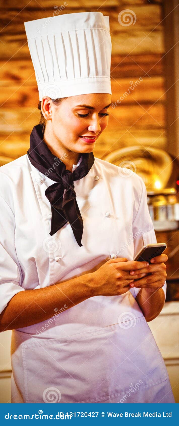 Chef using a smartphone stock image. Image of business - 131720427