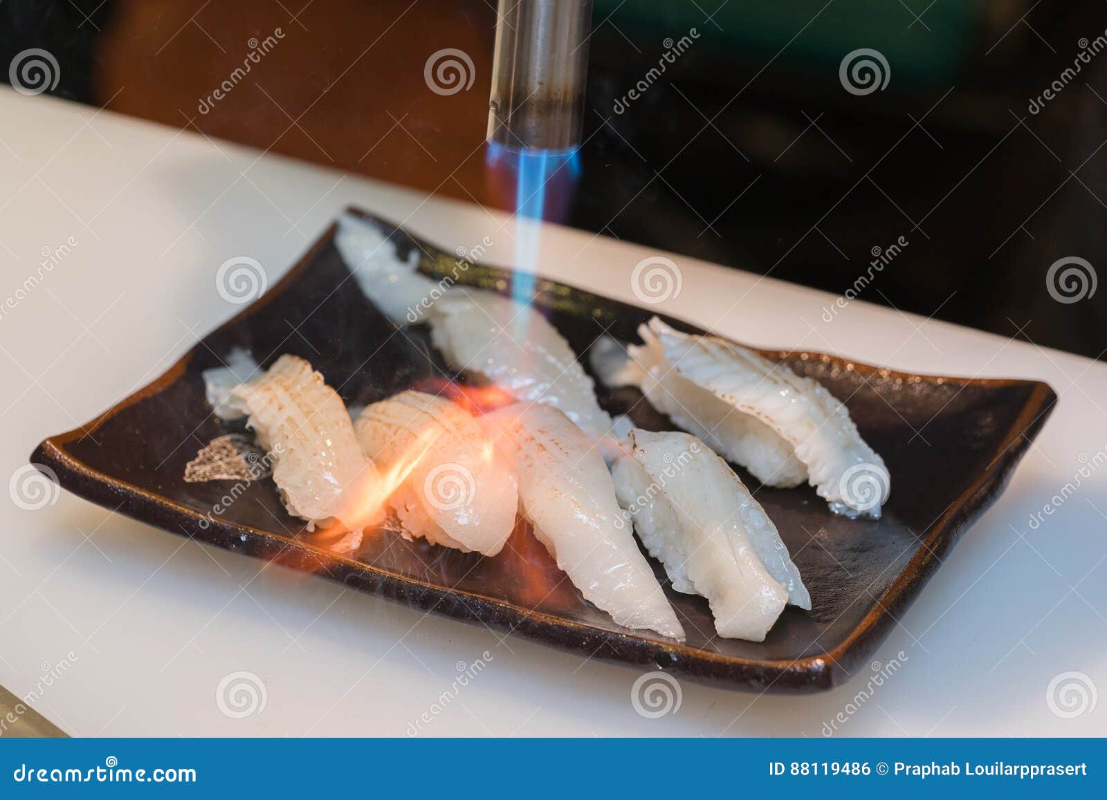 Chef Using a Torch Burn on Sushi in the Kitchen Stock Photo - Image of ...