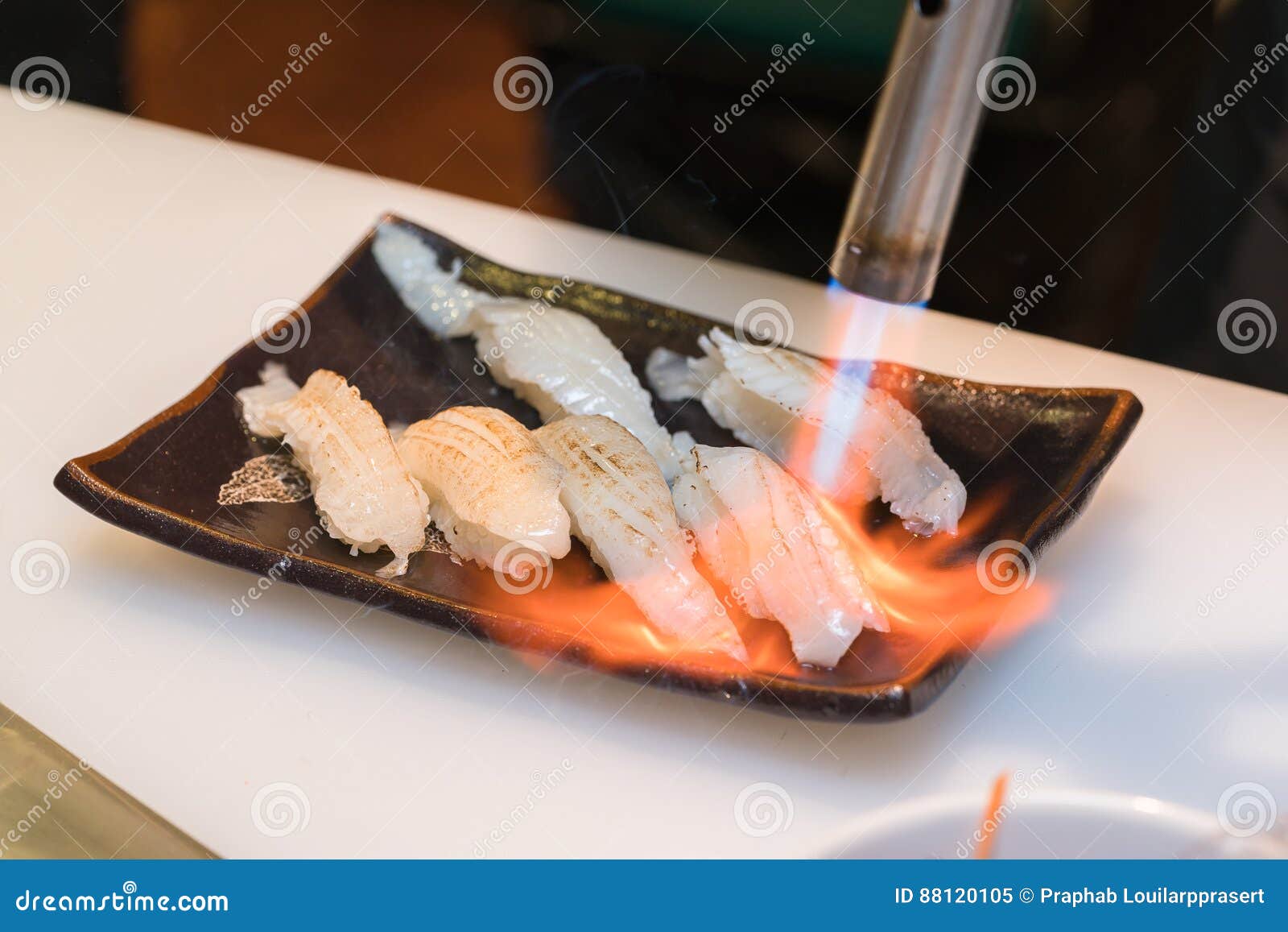 Chef Using a Torch Burn on Sushi in the Kitchen Stock Image - Image of ...