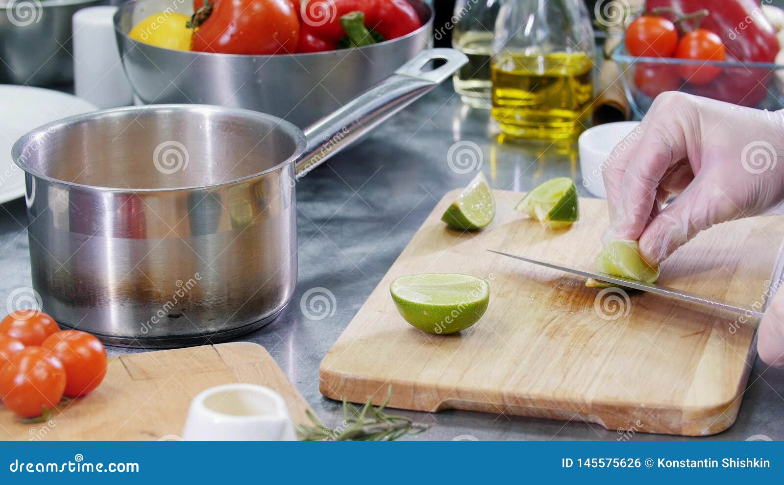 A Chef Working in the Kitchen. Cutting the Lime Stock Photo - Image of ...