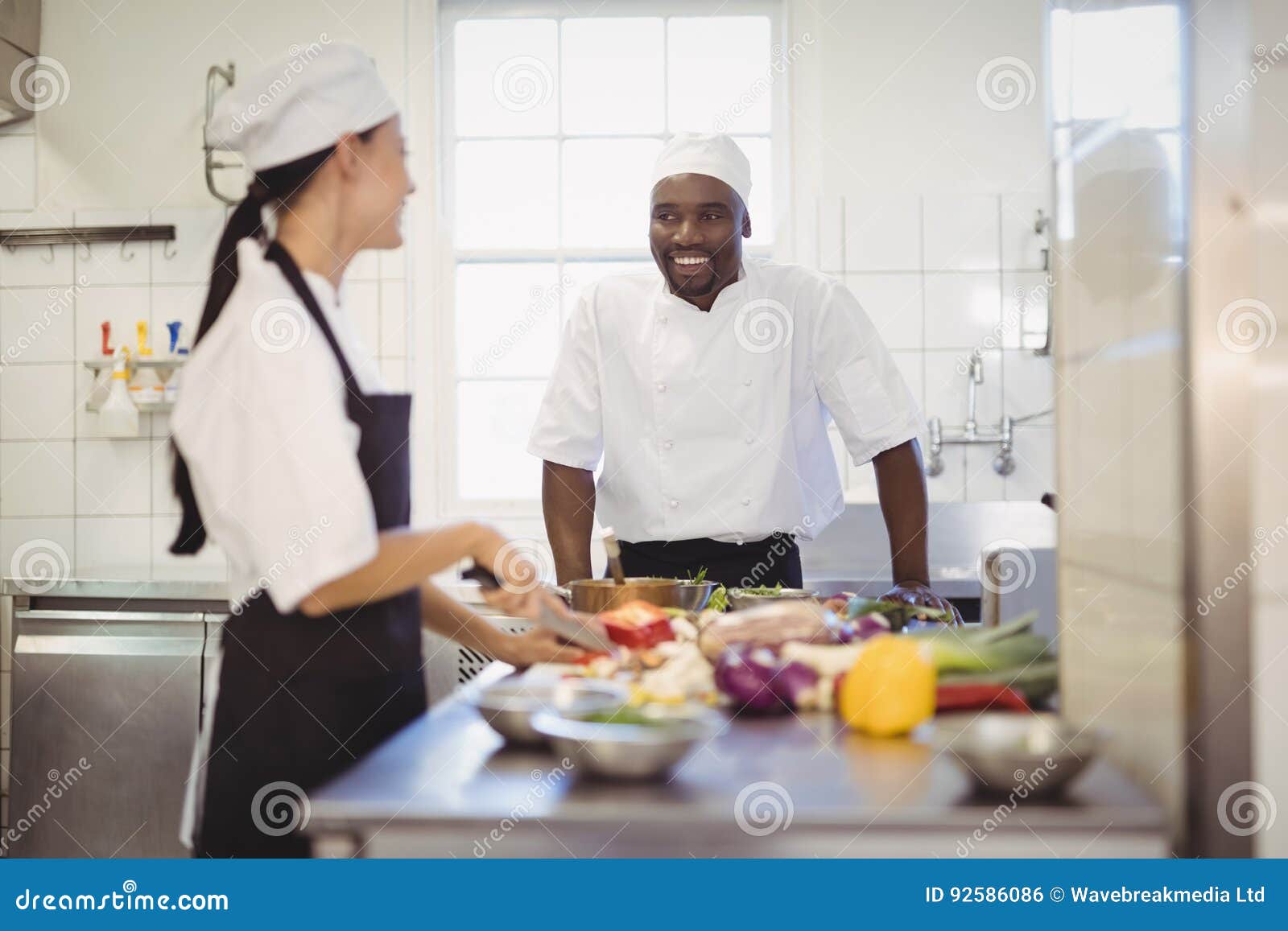 Chefs Chopping Vegetables in the Commercial Kitchen Stock Photo - Image ...