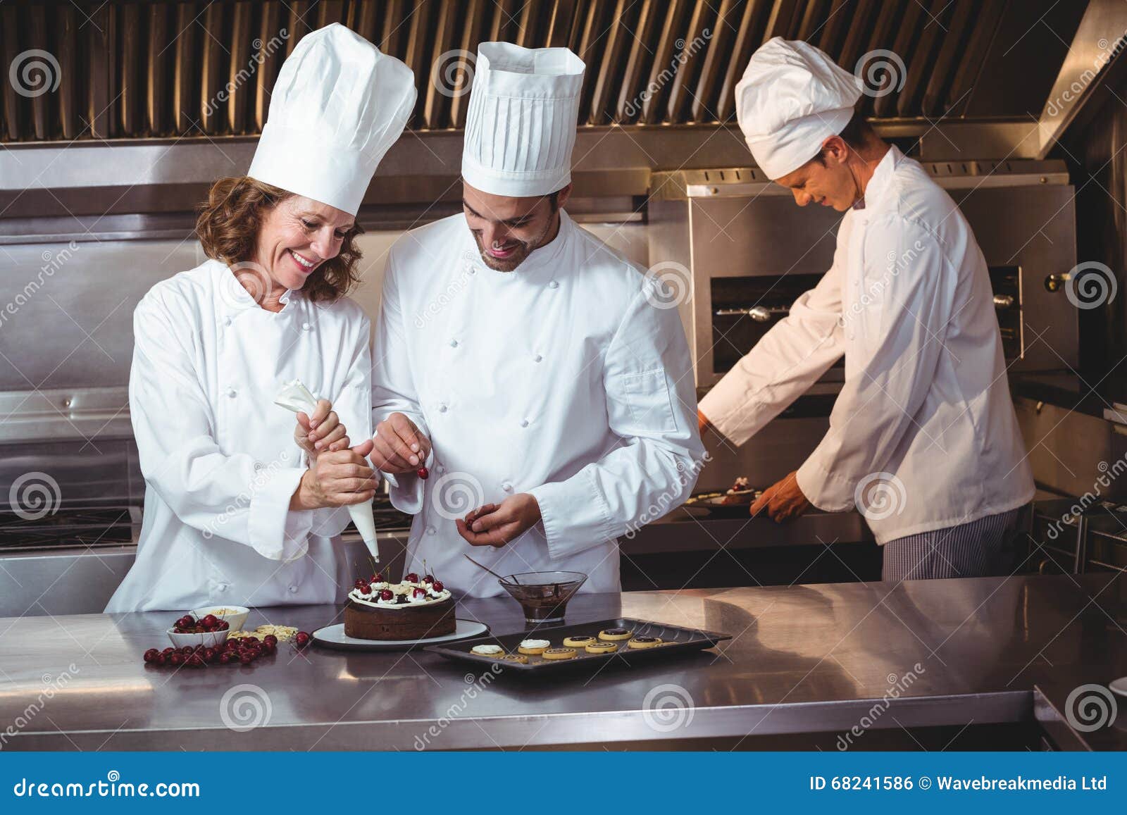 Chefs Decorating a Cake they Just Made Stock Photo - Image of catering ...