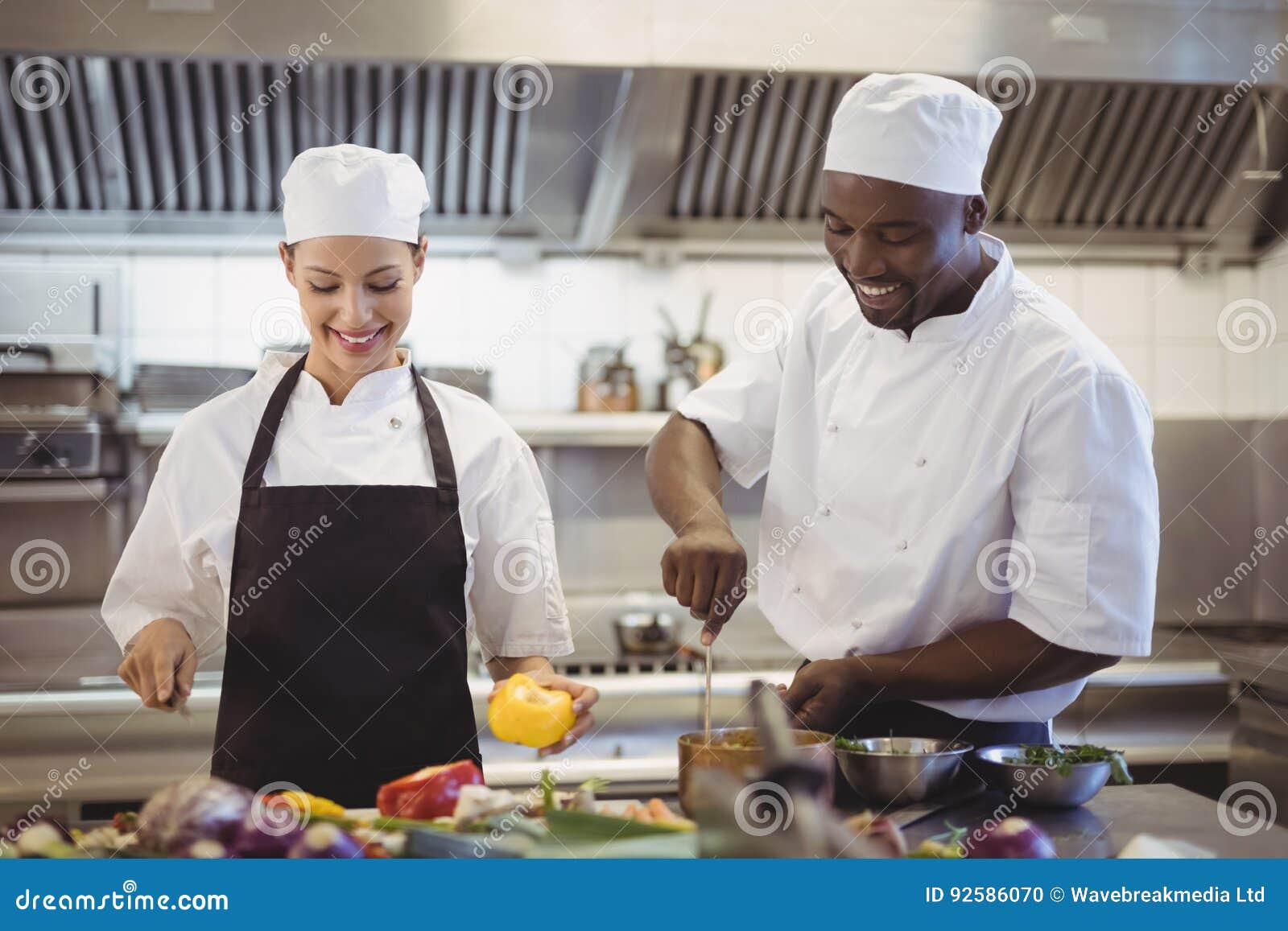 Chefs Preparing Food in the Commercial Kitchen Stock Photo - Image of ...