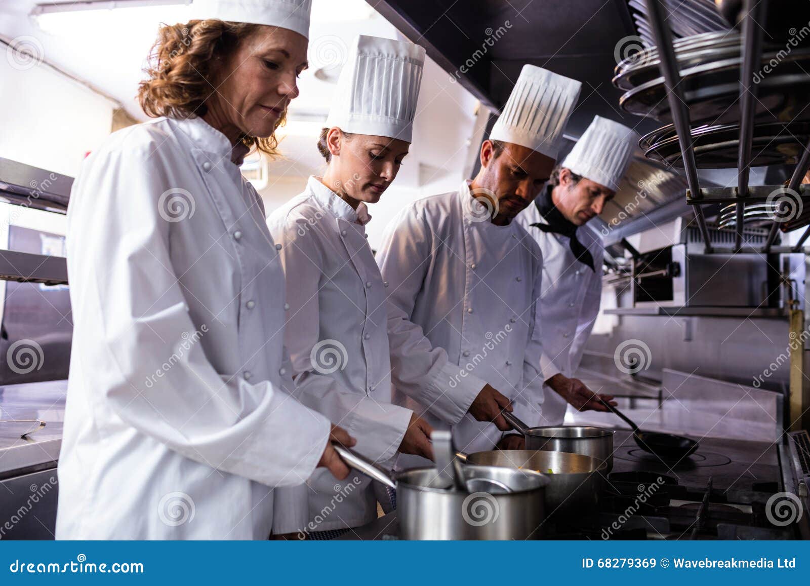 Chefs Preparing Food in Kitchen Stock Image - Image of stove ...
