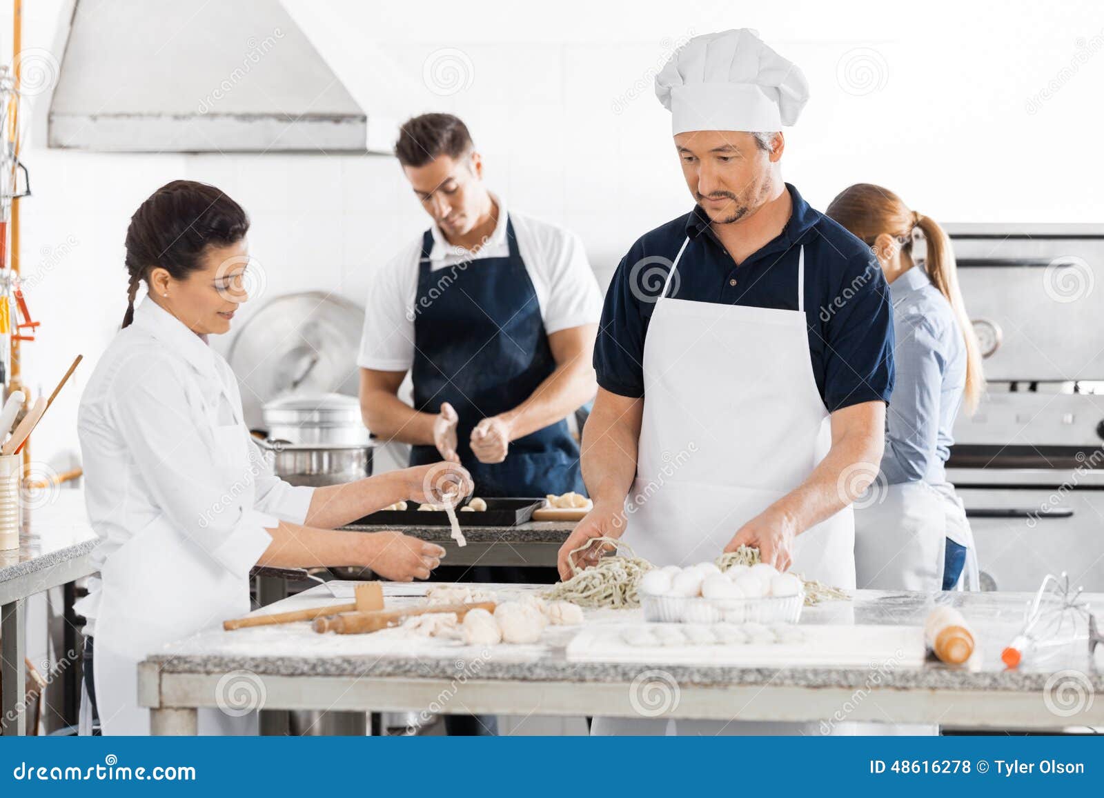 Chefs Preparing Pasta at Kitchen Counters Stock Photo - Image of ...