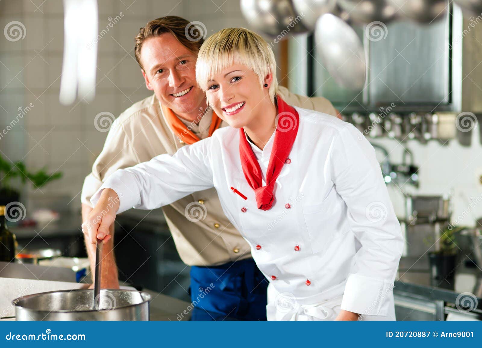 Chefs in a Restaurant or Hotel Kitchen Cooking Stock Image - Image of ...