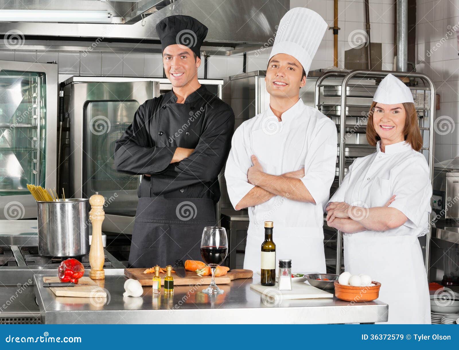 Chefs Standing with Arms Crossed Stock Image - Image of confident ...