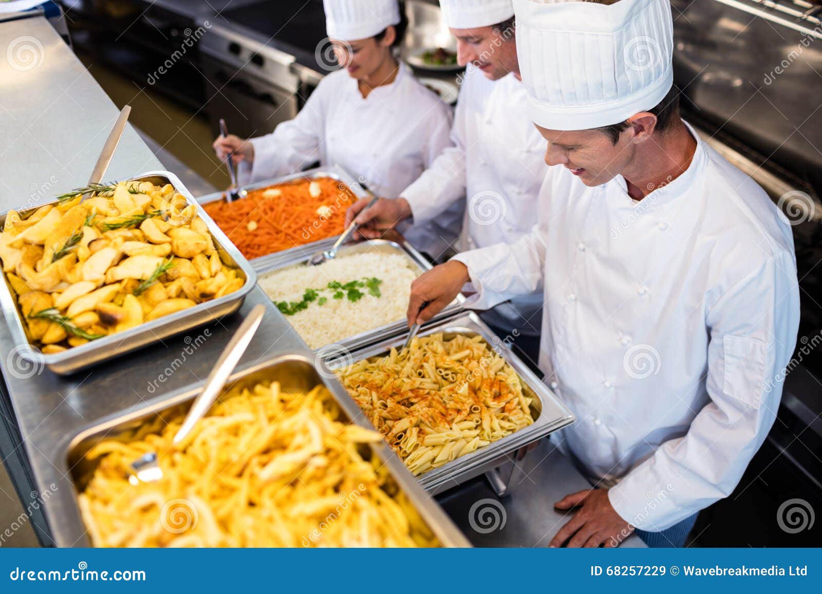 Chefs Standing at Serving Trays of Pasta Stock Image - Image of ...