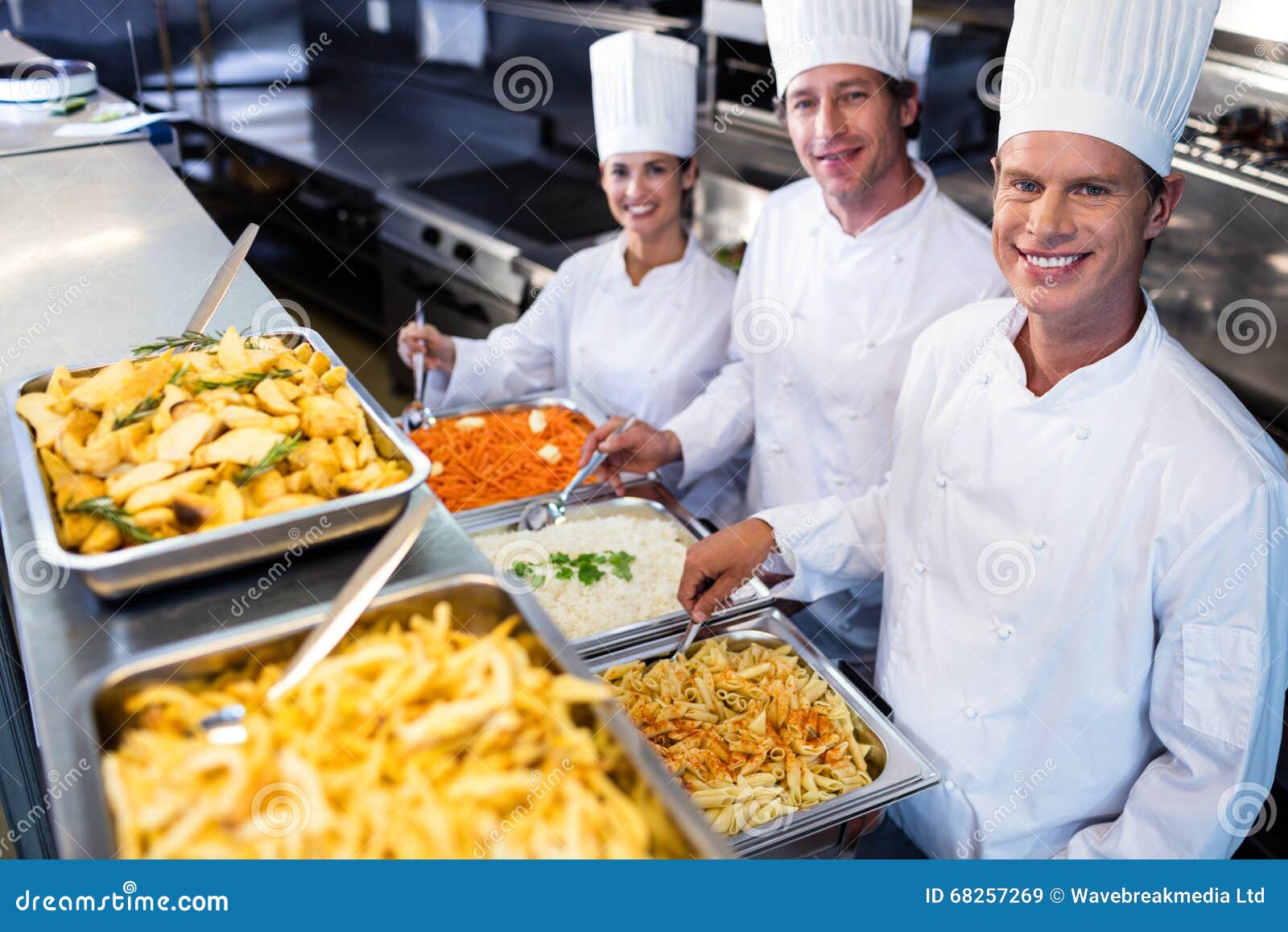 Chefs Standing at Serving Trays of Pasta Stock Image - Image of ladle ...