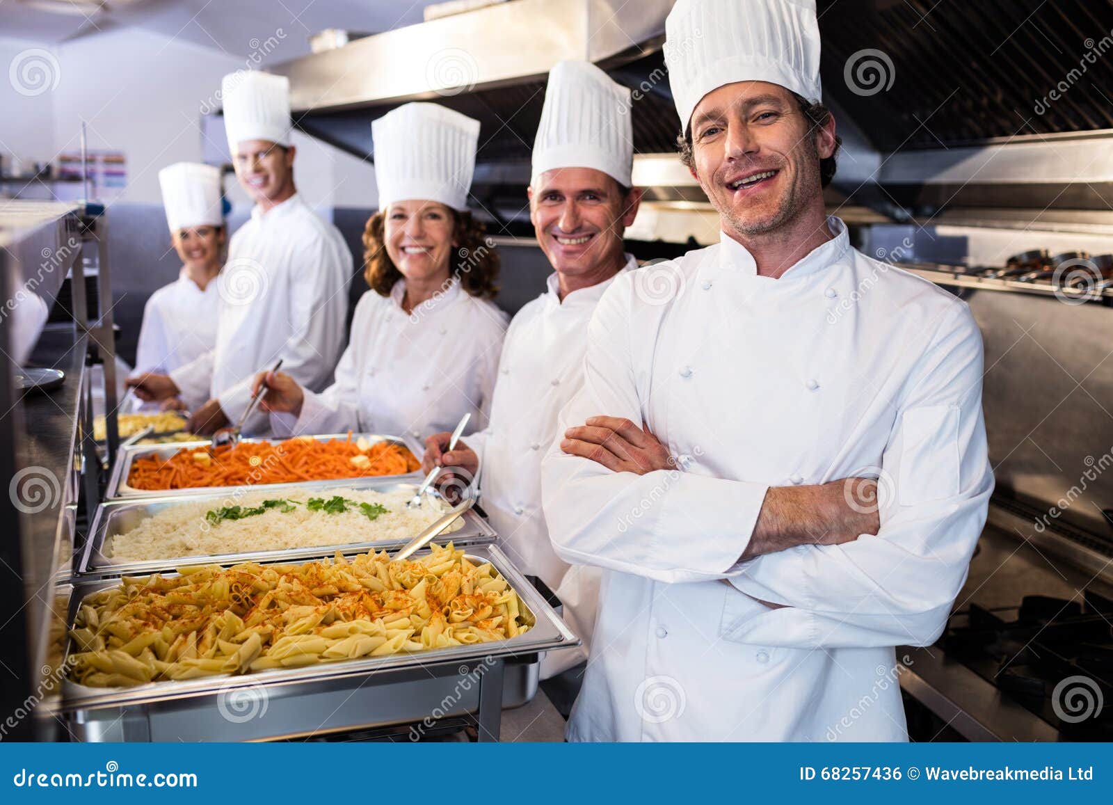 Chefs Standing at Serving Trays of Pasta Stock Photo - Image of chef ...